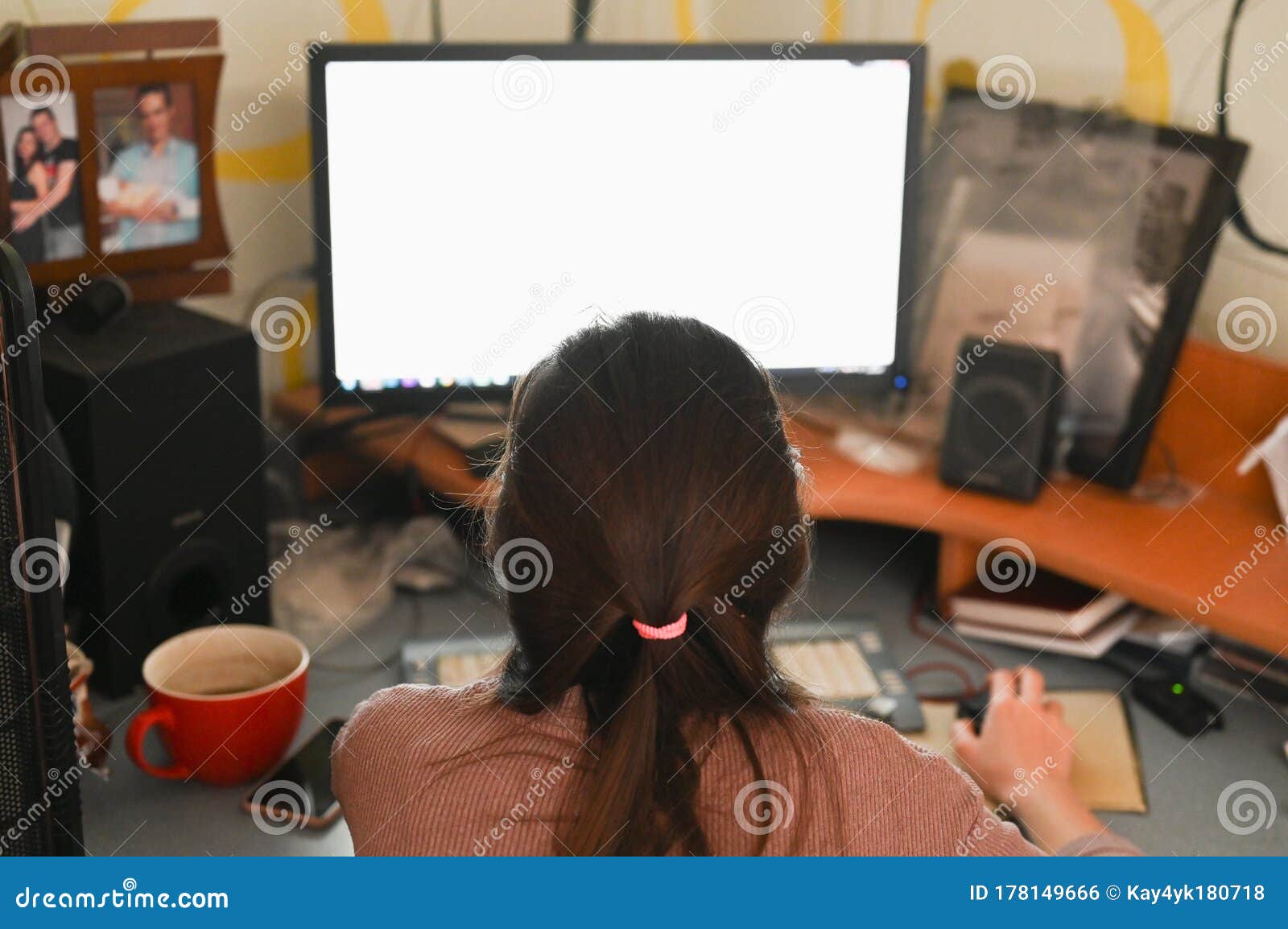 Girl Works Behind Computer Monitors. Background. Remote Work. Freelance ... Girl Works Behind Computer Monitors. Background. Remote Work. Freelance ...