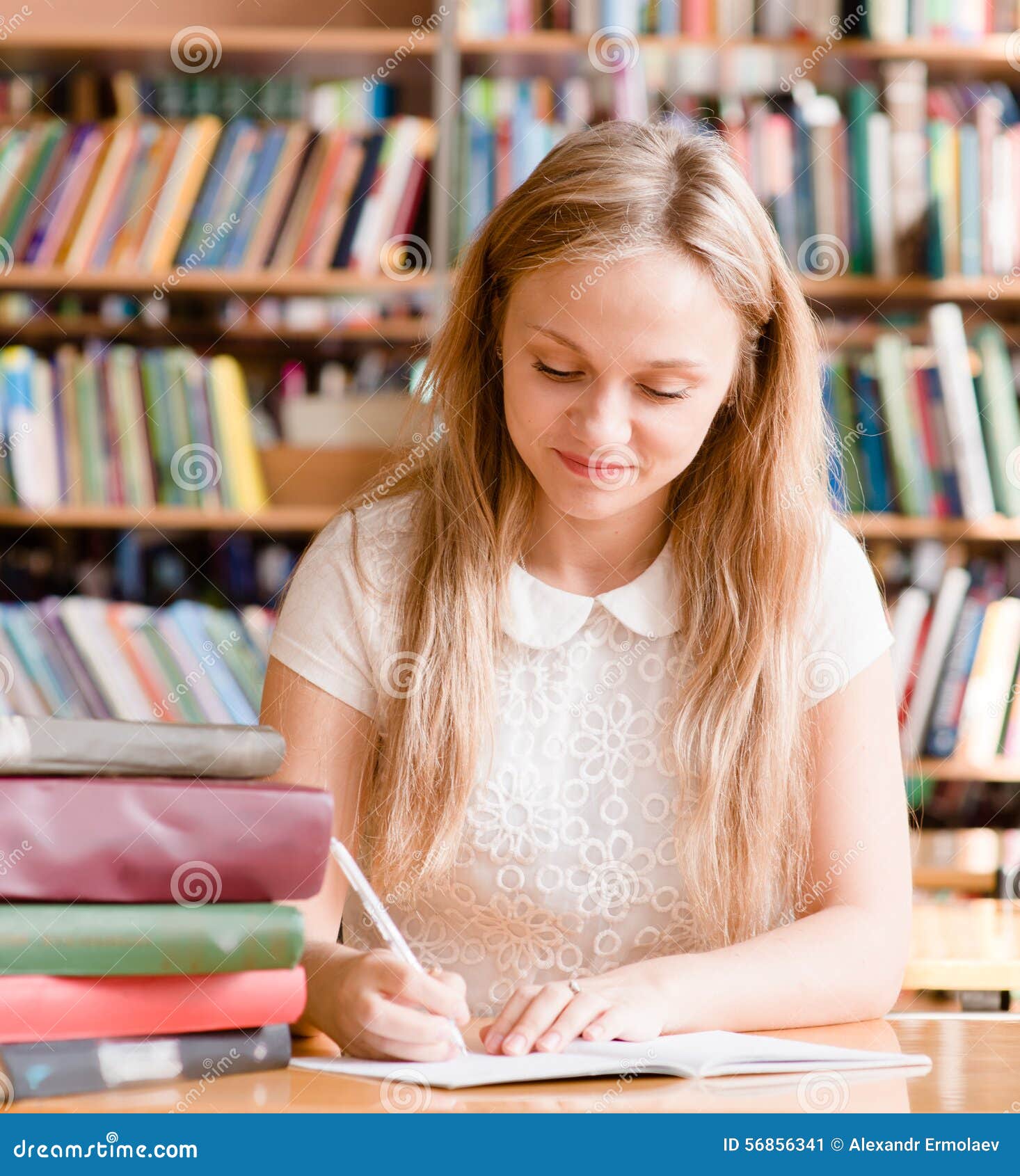 Girl Writes Essay in the Library Stock Image - Image of book, education ...