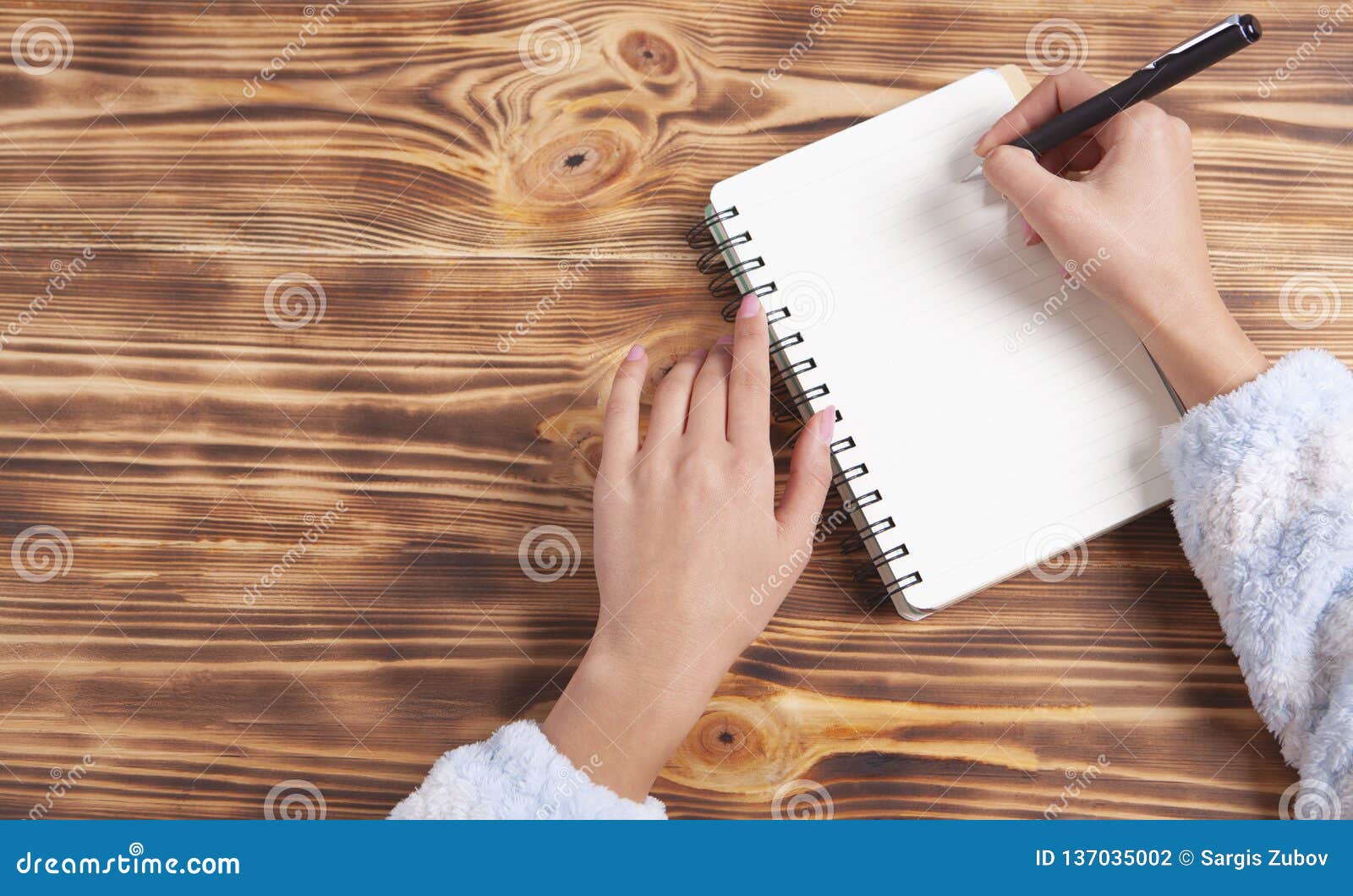 Girl writes in a notebook stock photo. Image of office - 137035002