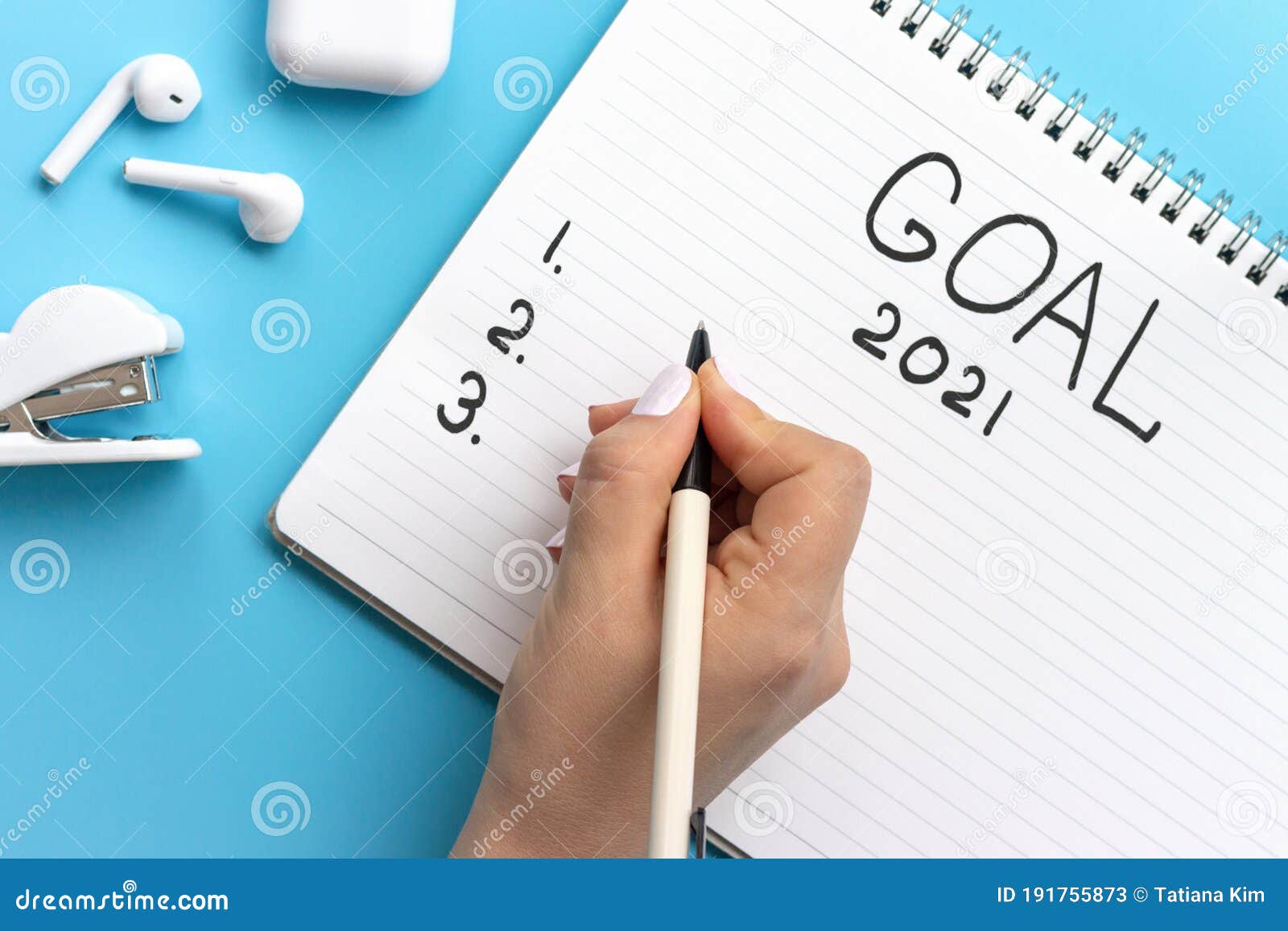 Girl Writes in Notepad of Goal for 2021 on a Blue Background Stock ...