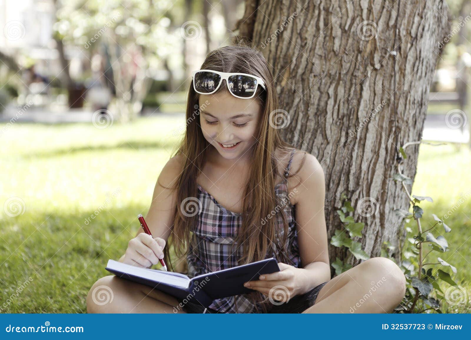 Girl Writes Something in Notebook Stock Image - Image of college ...