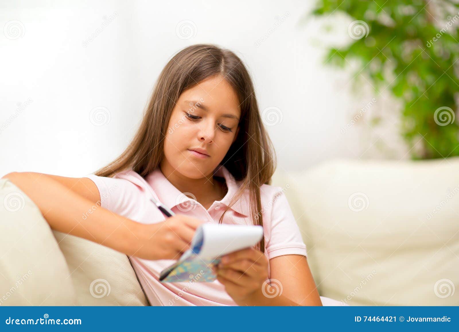 Girl writing in a diary stock image. Image of teenager - 74464421
