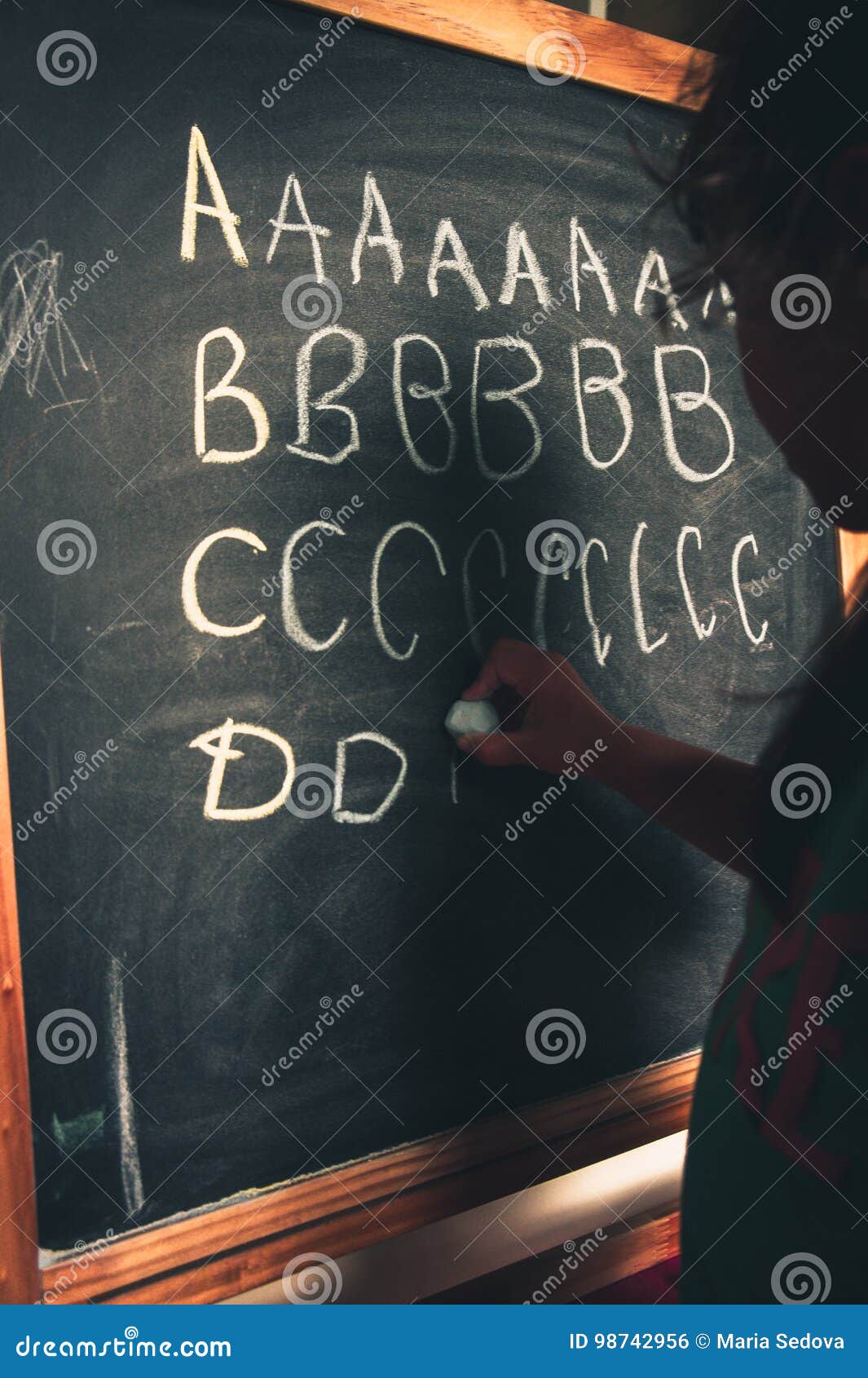 Girl Writing Letters on a Chalkboard Stock Photo - Image of worksheet ...