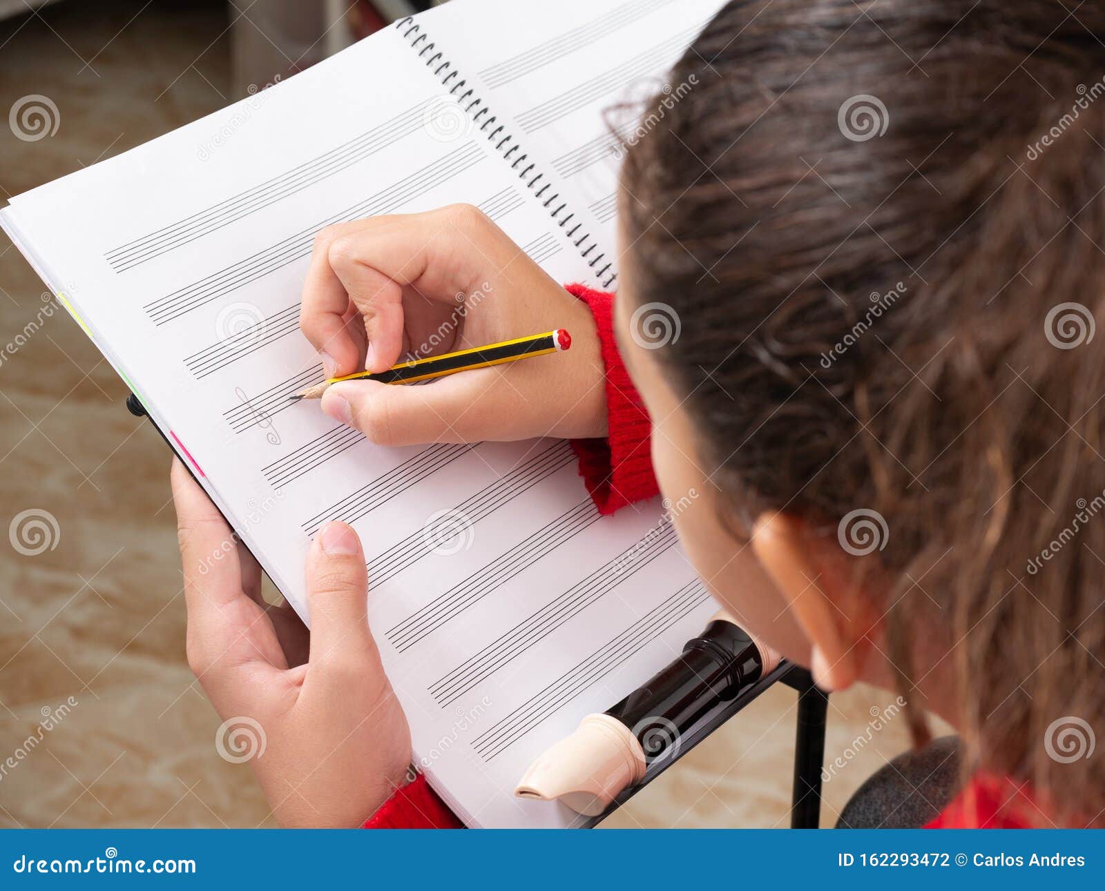 Girl Writing Musical Notes on the Stave Stock Photo - Image of ...