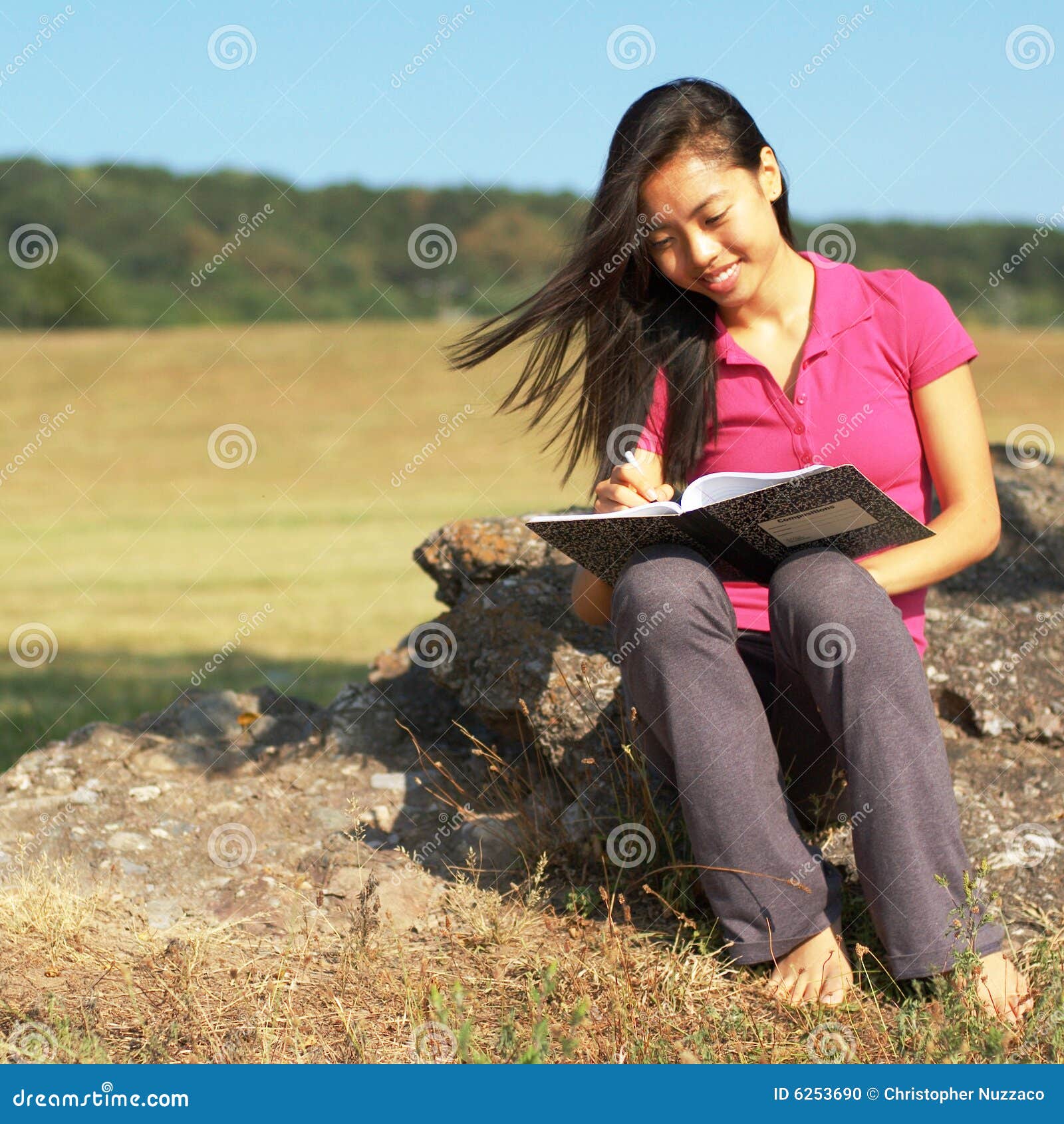 Girl Writing in Note Book stock photo. Image of education - 6253690