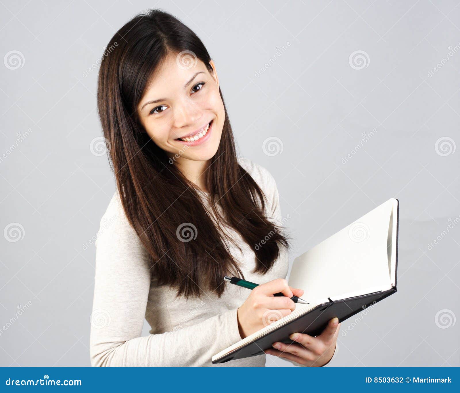 Girl writing in notebook stock photo. Image of chinese - 8503632
