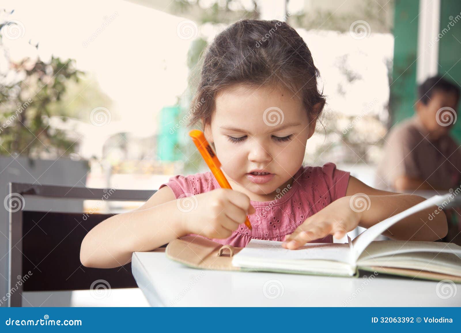 The Girl Writing in a Notebook in a Cafe Stock Photo - Image of letters ...