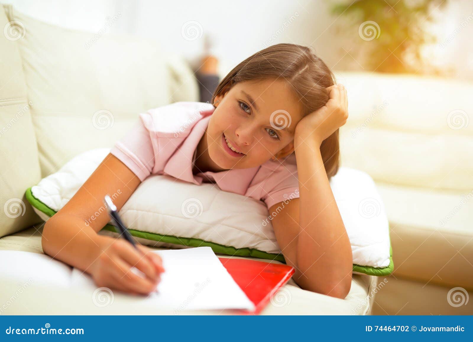 Girl writing in a notebook stock photo. Image of colored - 74464702