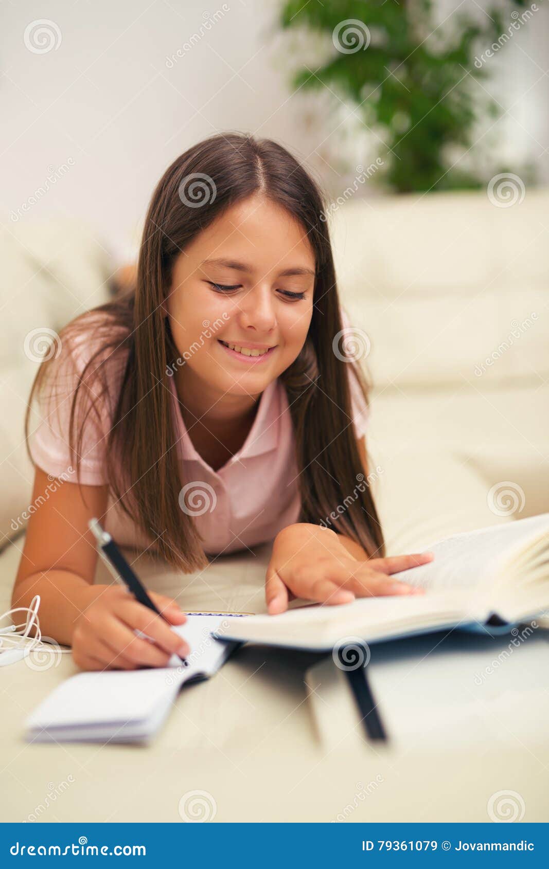 Girl writing in a notebook stock image. Image of homework - 79361079