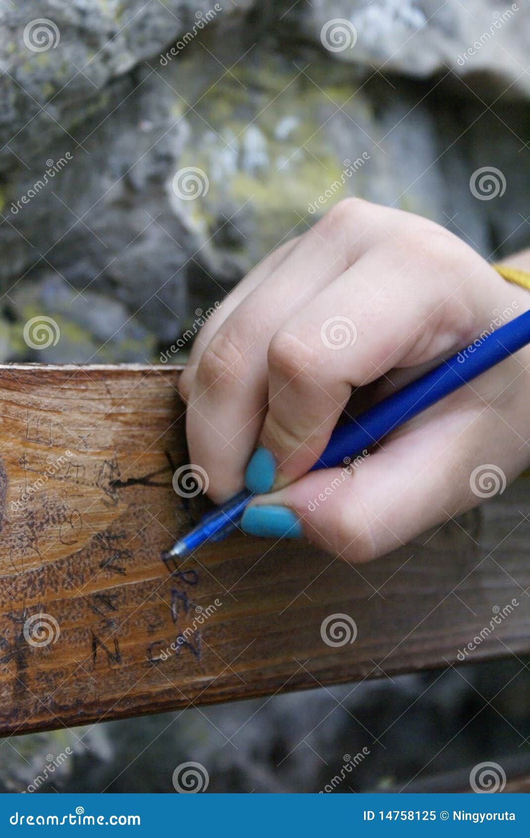 Girl writing on wood bench stock image. Image of fingers - 14758125
