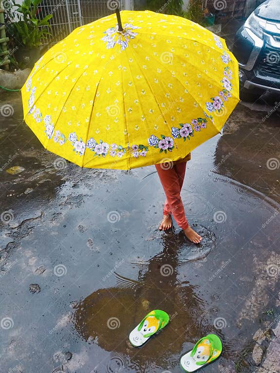 A Girl With Yellow Umbrella Under The Rain Stock Image Image Of