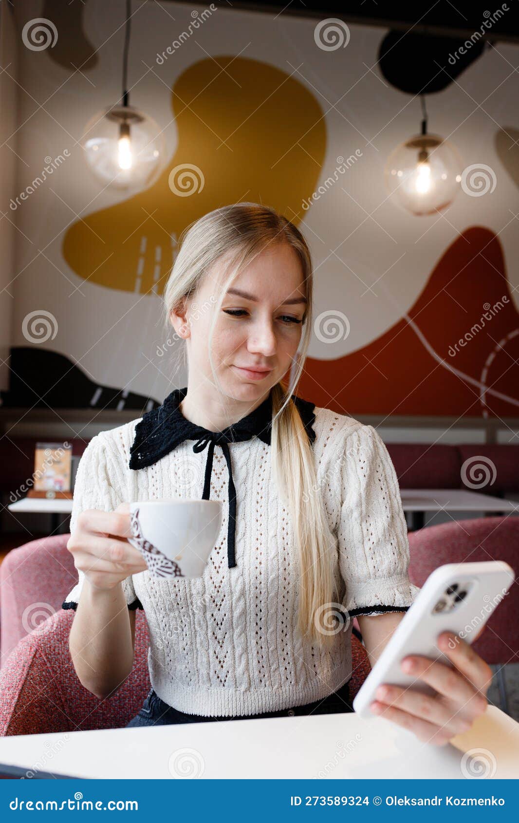 A Girl Works at a Computer in a Coffee Shop. Stock Photo - Image of ...