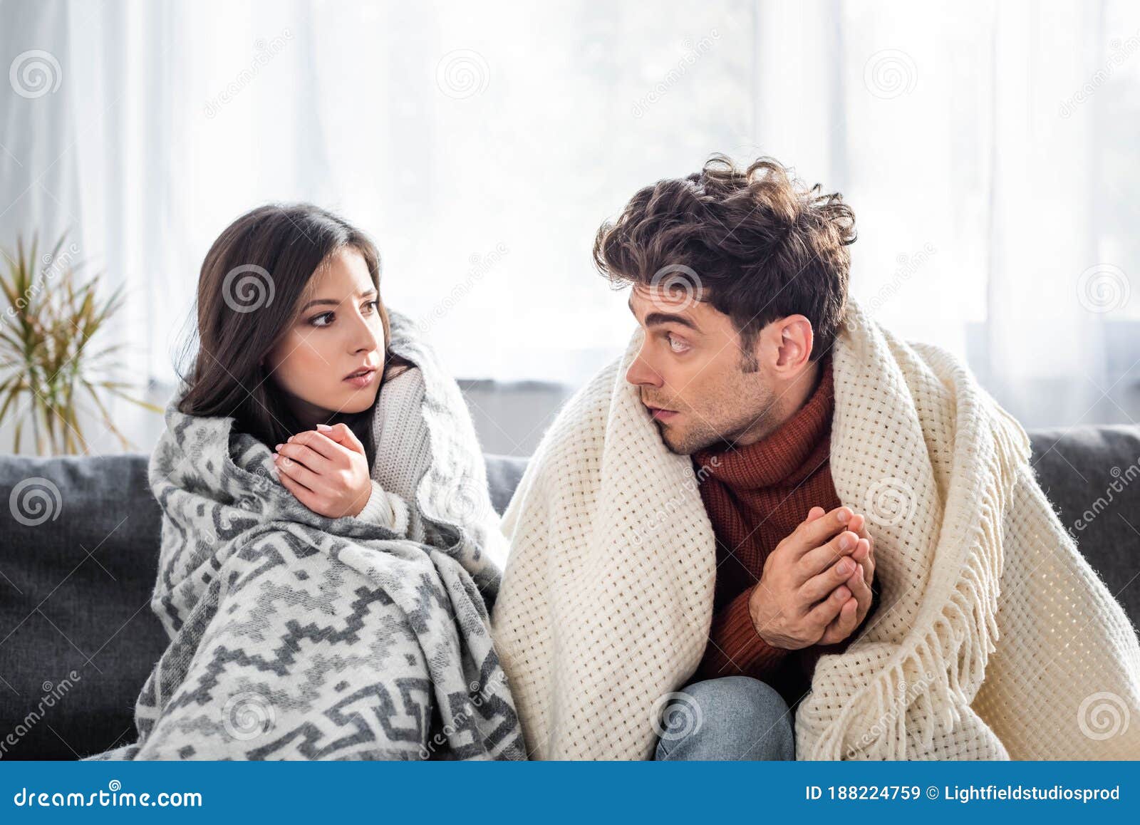 Girlfriend and Boyfriend Covered with Blankest and Feeling Cold Stock ...