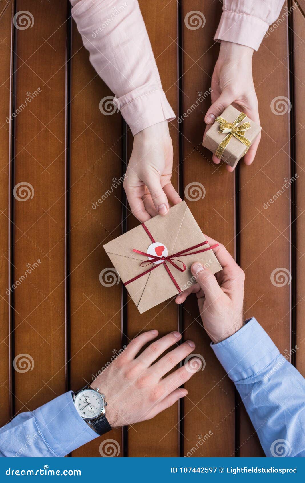 Girlfriend Gifting Postcard in Envelope and Present Box To Boyfriend ...