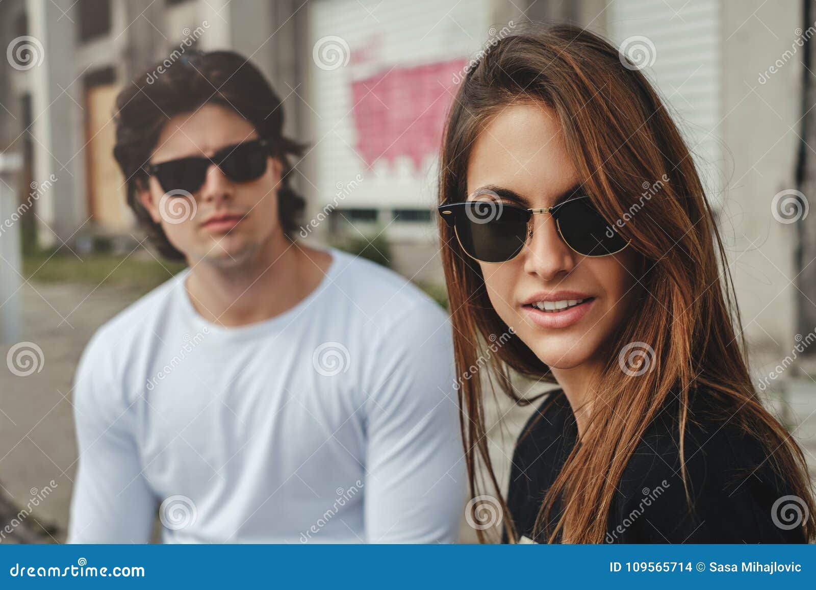 Girlfriend Looking To the Side while Her Boyfriend is Behind Stock ...