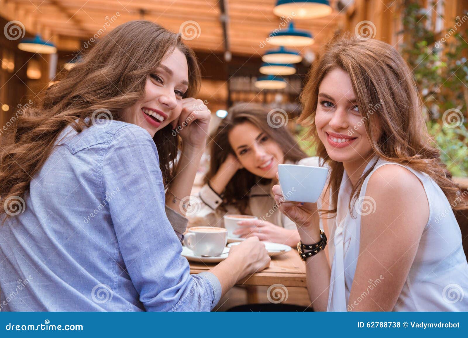Girlfriends Drinking Coffee in Cafe Stock Photo - Image of camera, cafe ...