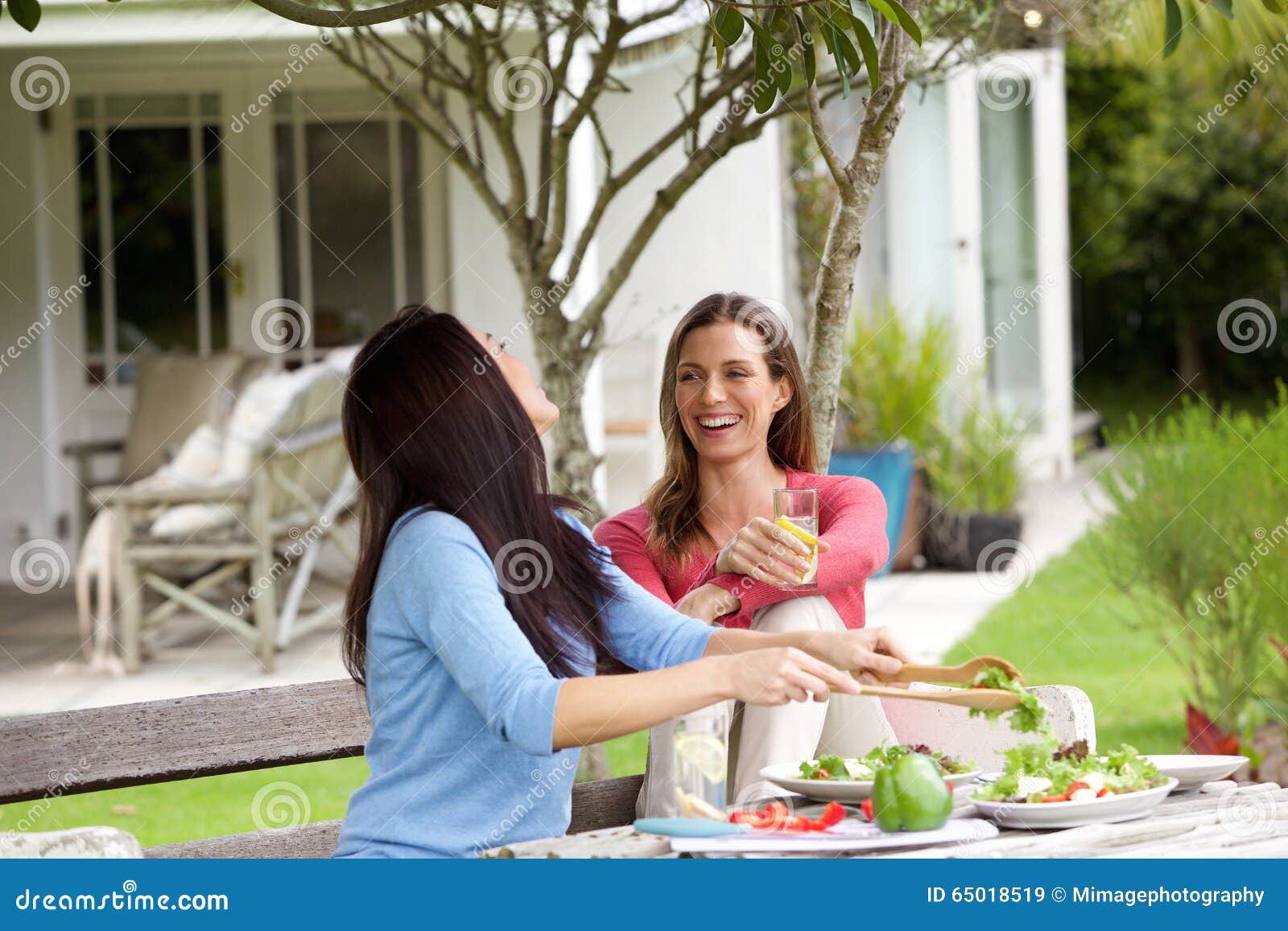 Girlfriends Enjoying Life at Home with Lunch Stock Image - Image of ...