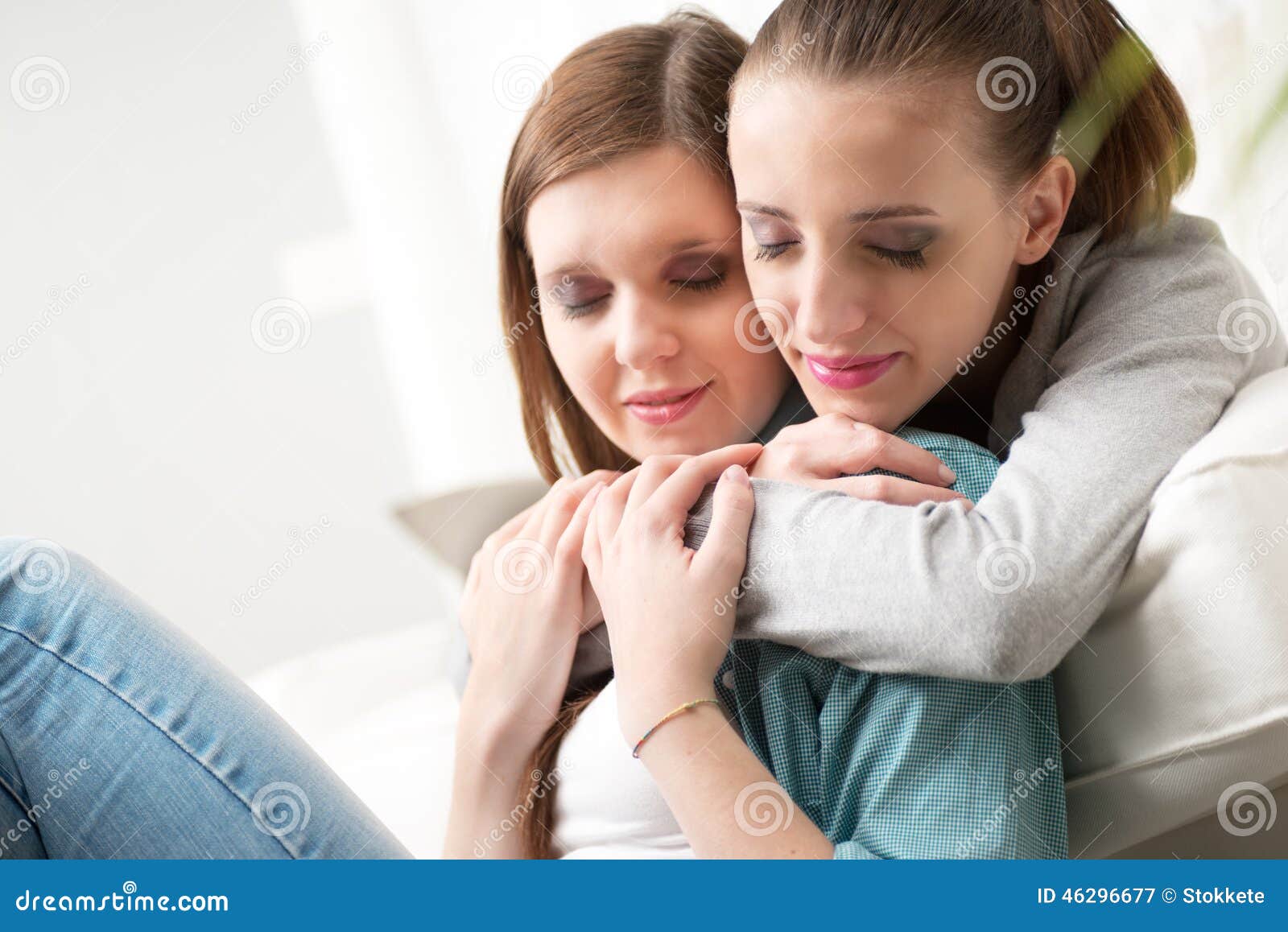 Girlfriends Hugging on Sofa Stock Image - Image of emotions, closed ...
