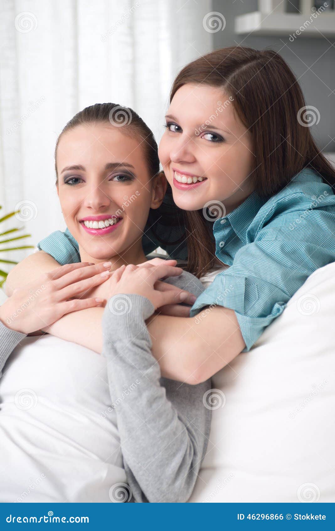Girlfriends Hugging on Sofa Stock Photo - Image of homosexual, female ...