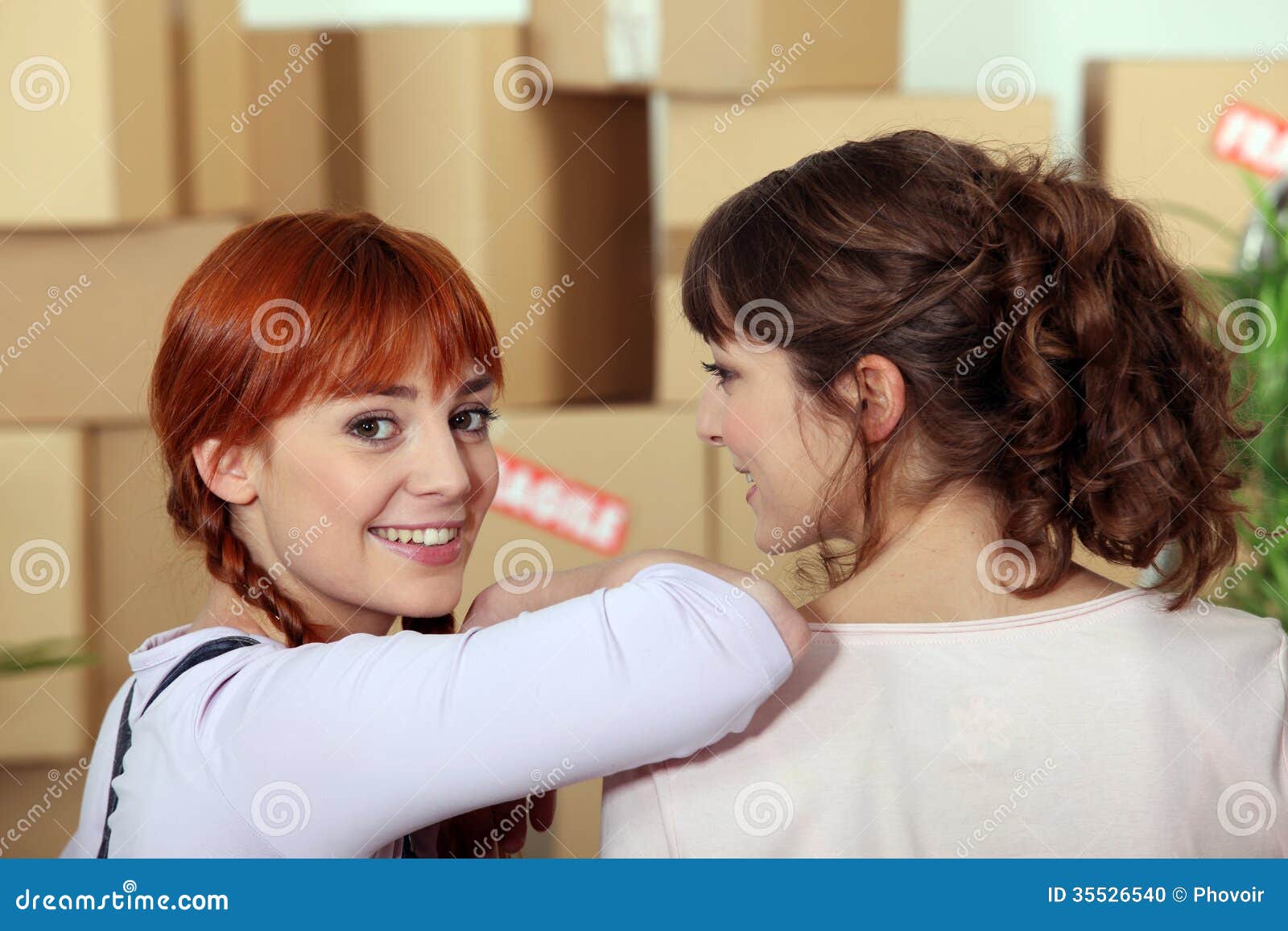 Girlfriends Moving into an Apartment Stock Photo - Image of girl ...