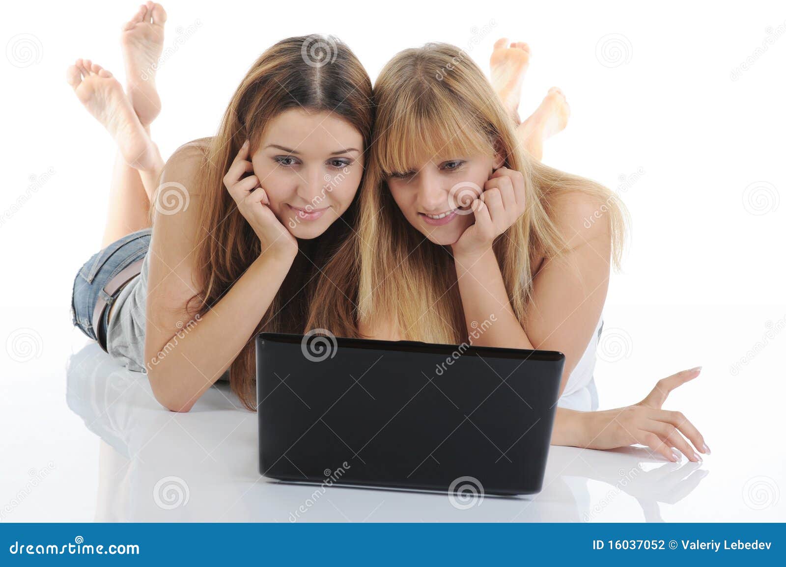 Girlfriends with a Notebook Stock Photo - Image of astonishment, long ...