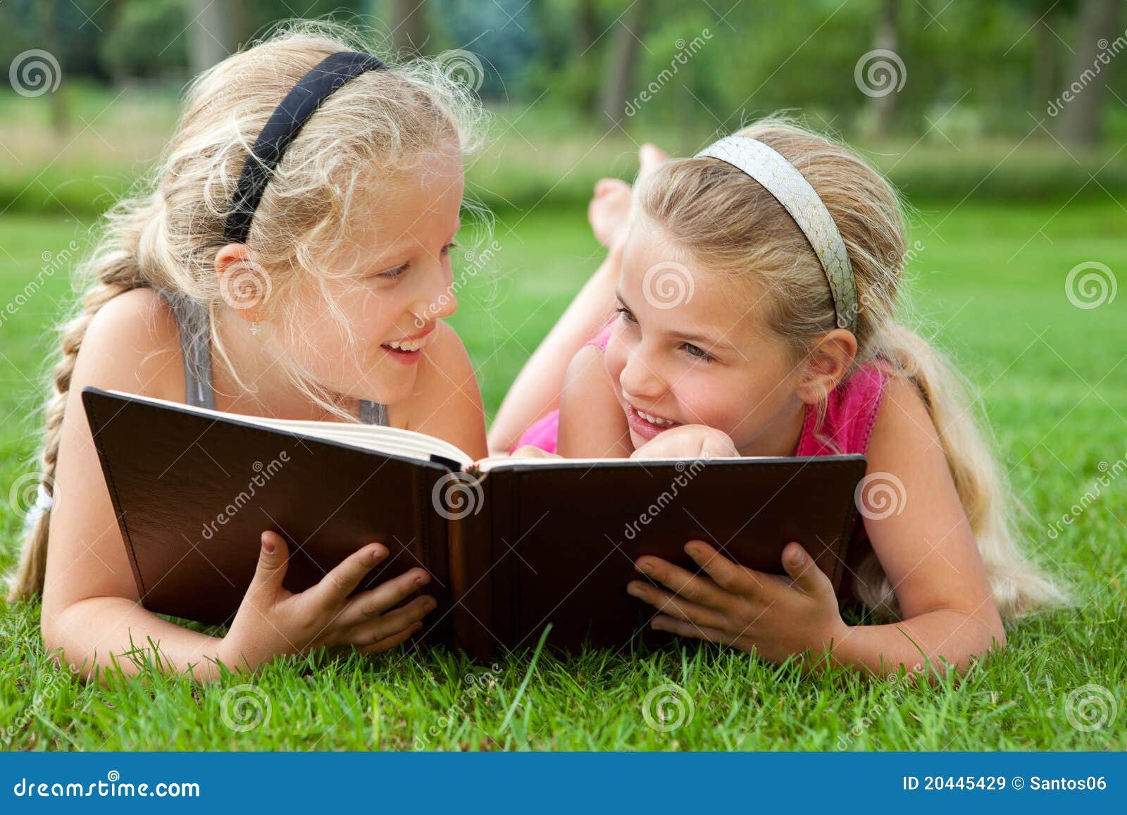 Girlfriends Reading a Book Outdoors Stock Image - Image of park ...