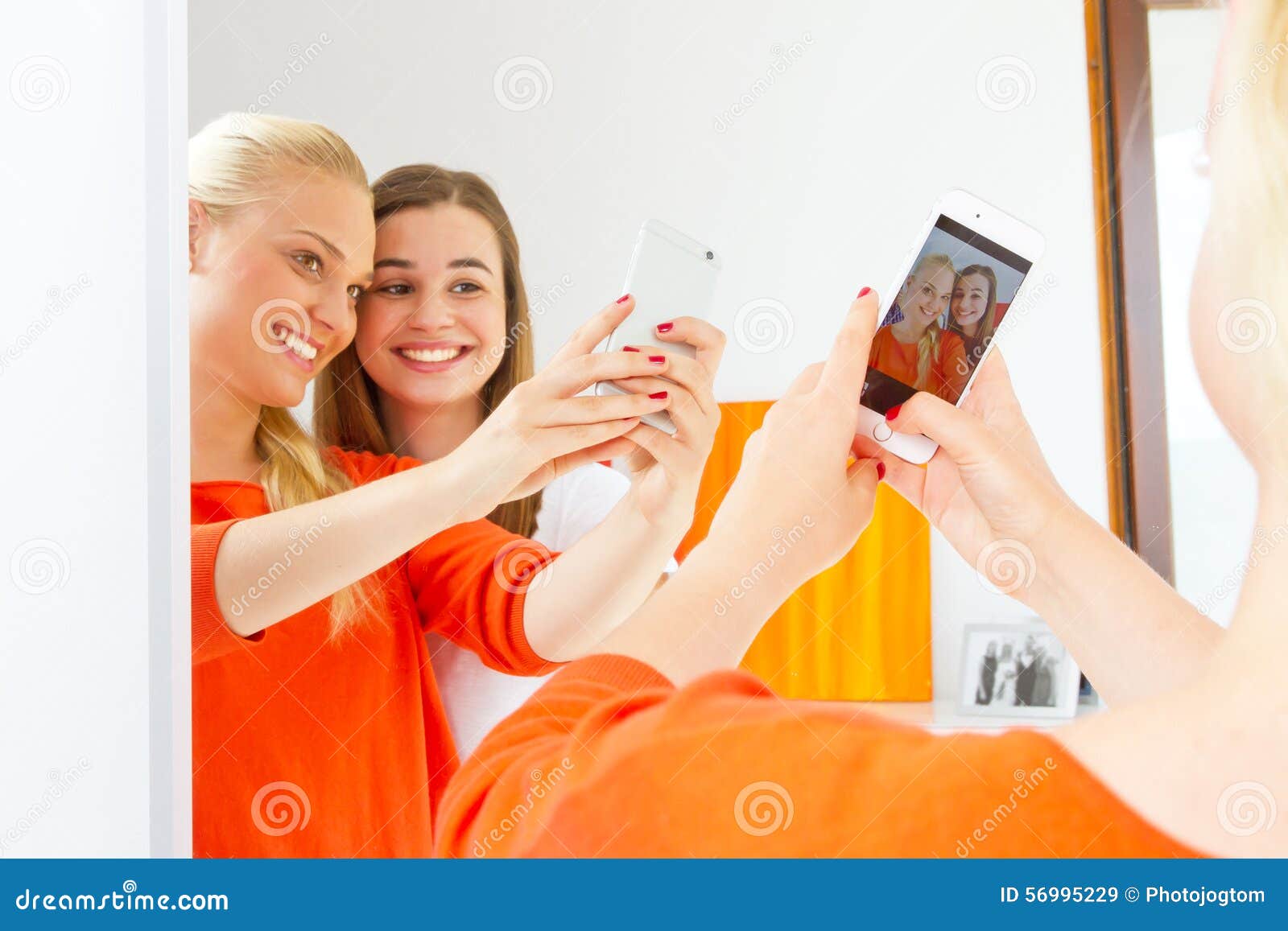 Girlfriends with Smart Phone Stock Image - Image of outdoor, female ...