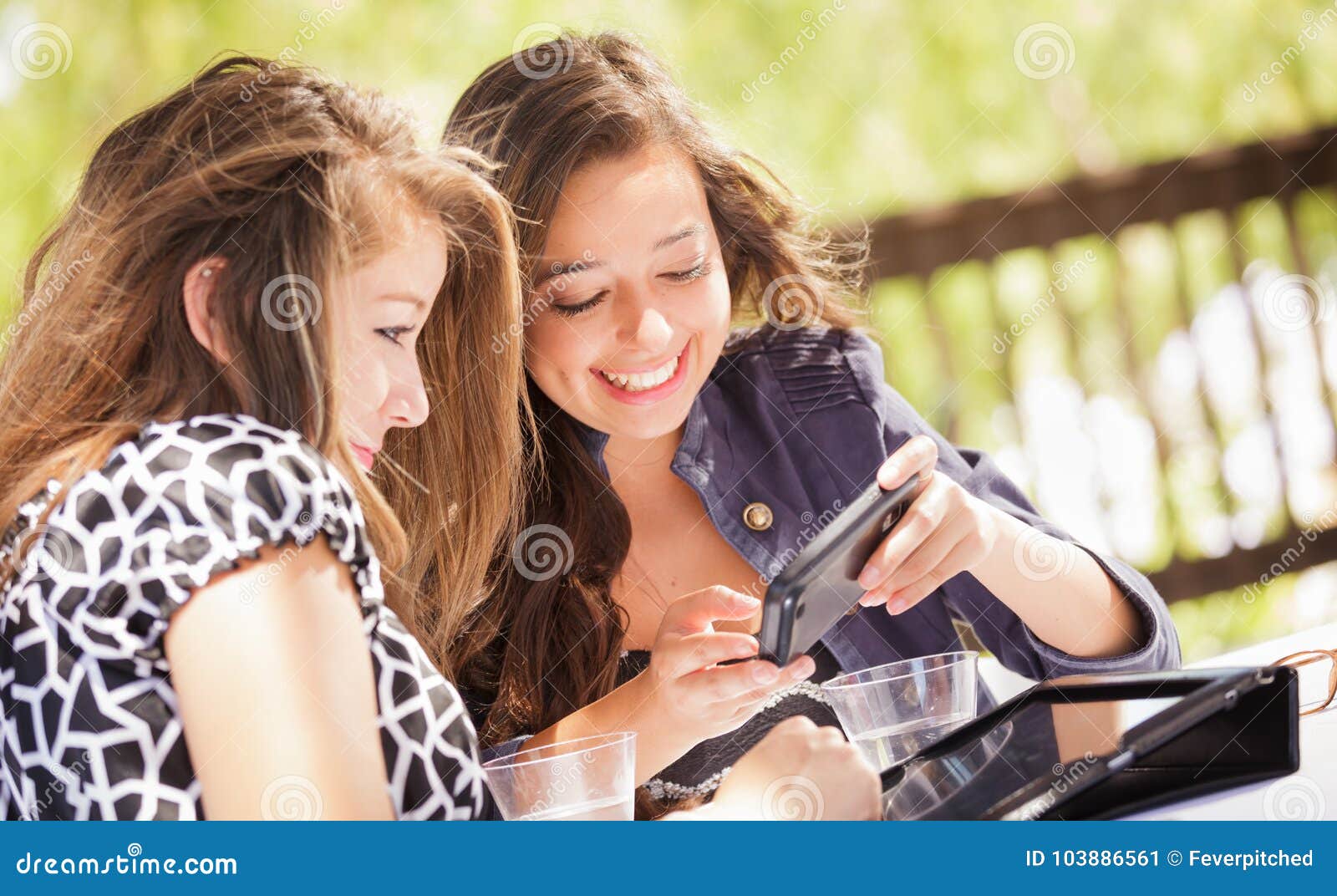 Two Girlfriends Using Smartphone Connect Communication Emotional
