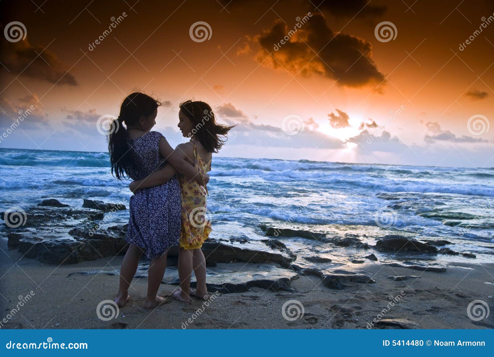 Girls beach sunset stock photo. Image of beautiful, orange - 5414480