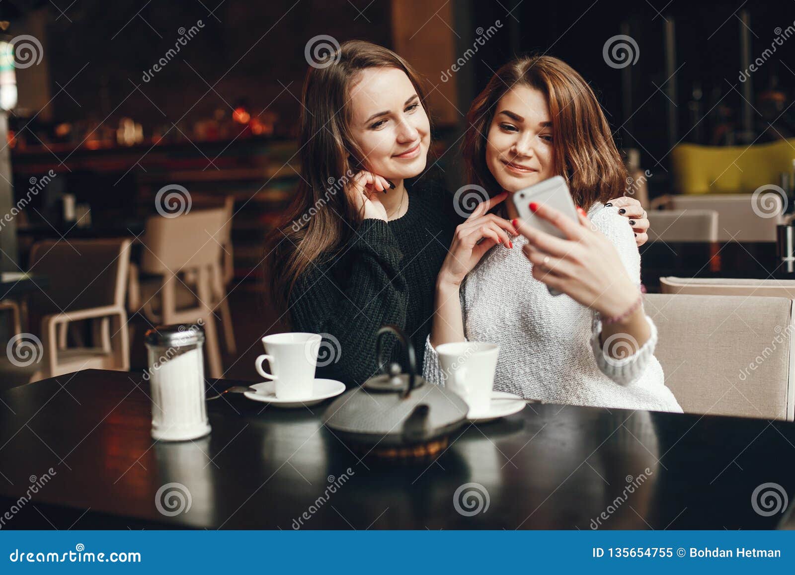 Girls with coffee stock image. Image of autumn, model - 135654755