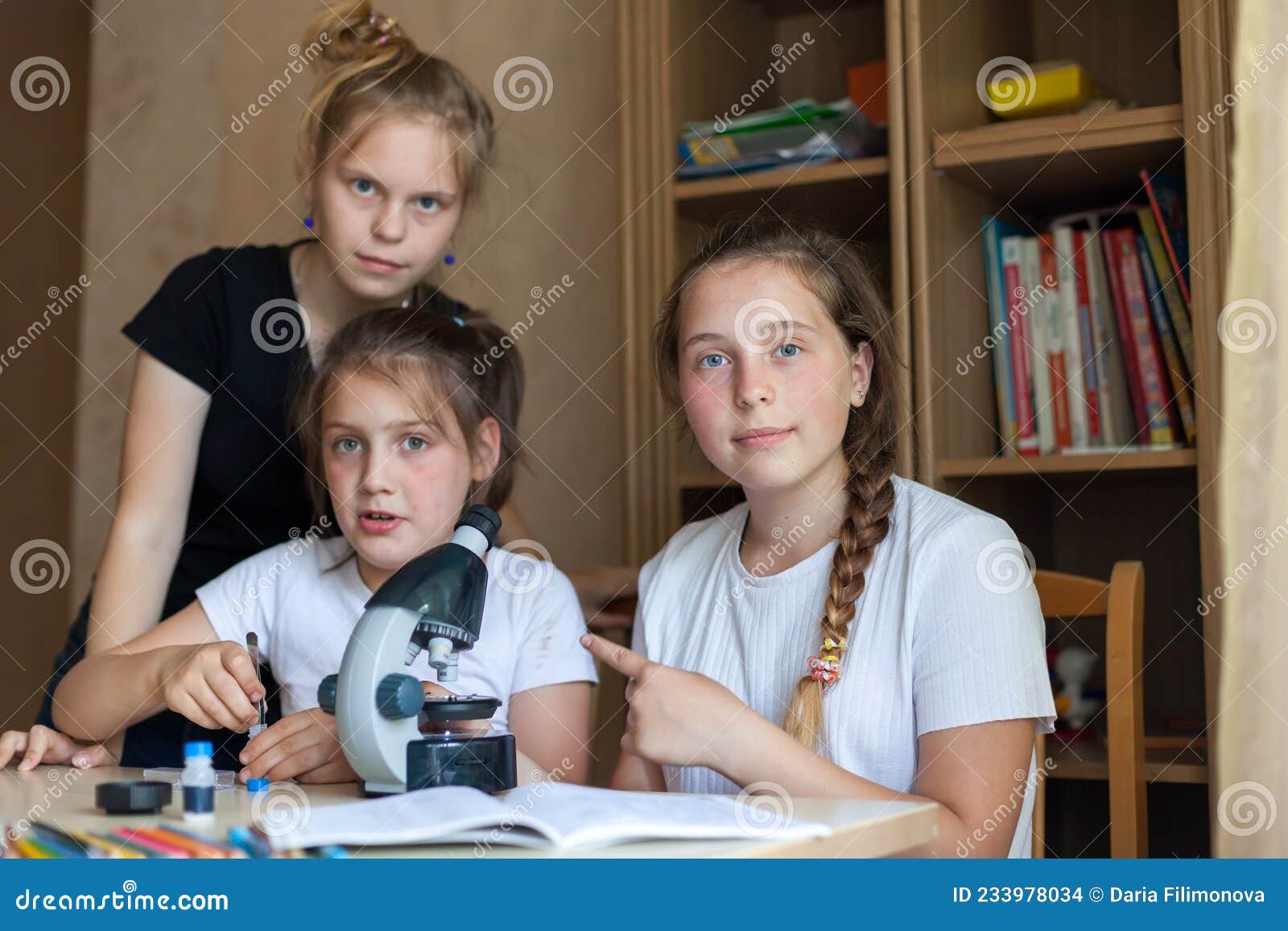 Girls Doing Homework at Table Stock Photo - Image of home, schoolgirl ...