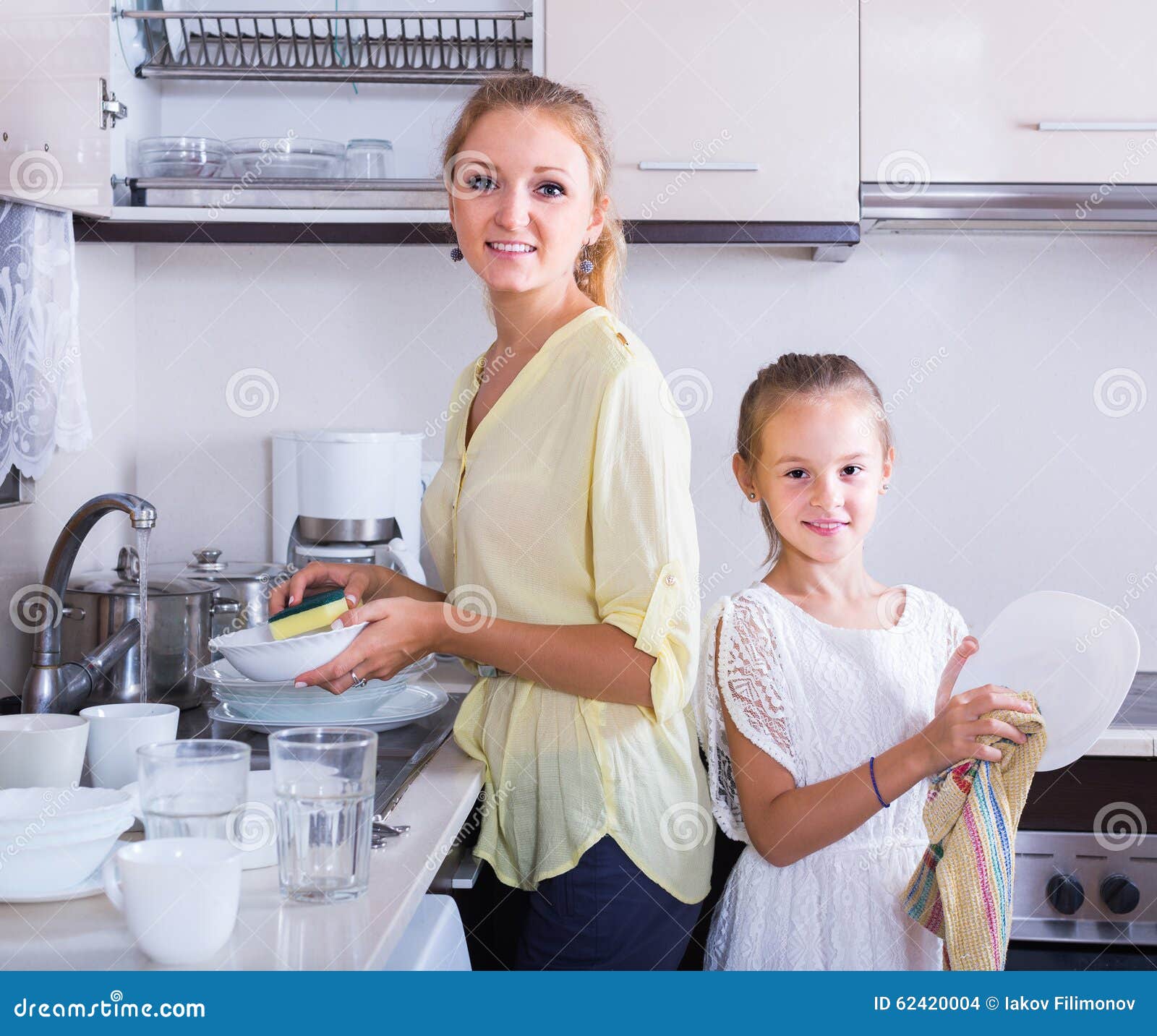 Girls Doing and Wiping Dishes in Kitchen Stock Photo - Image of chores ...