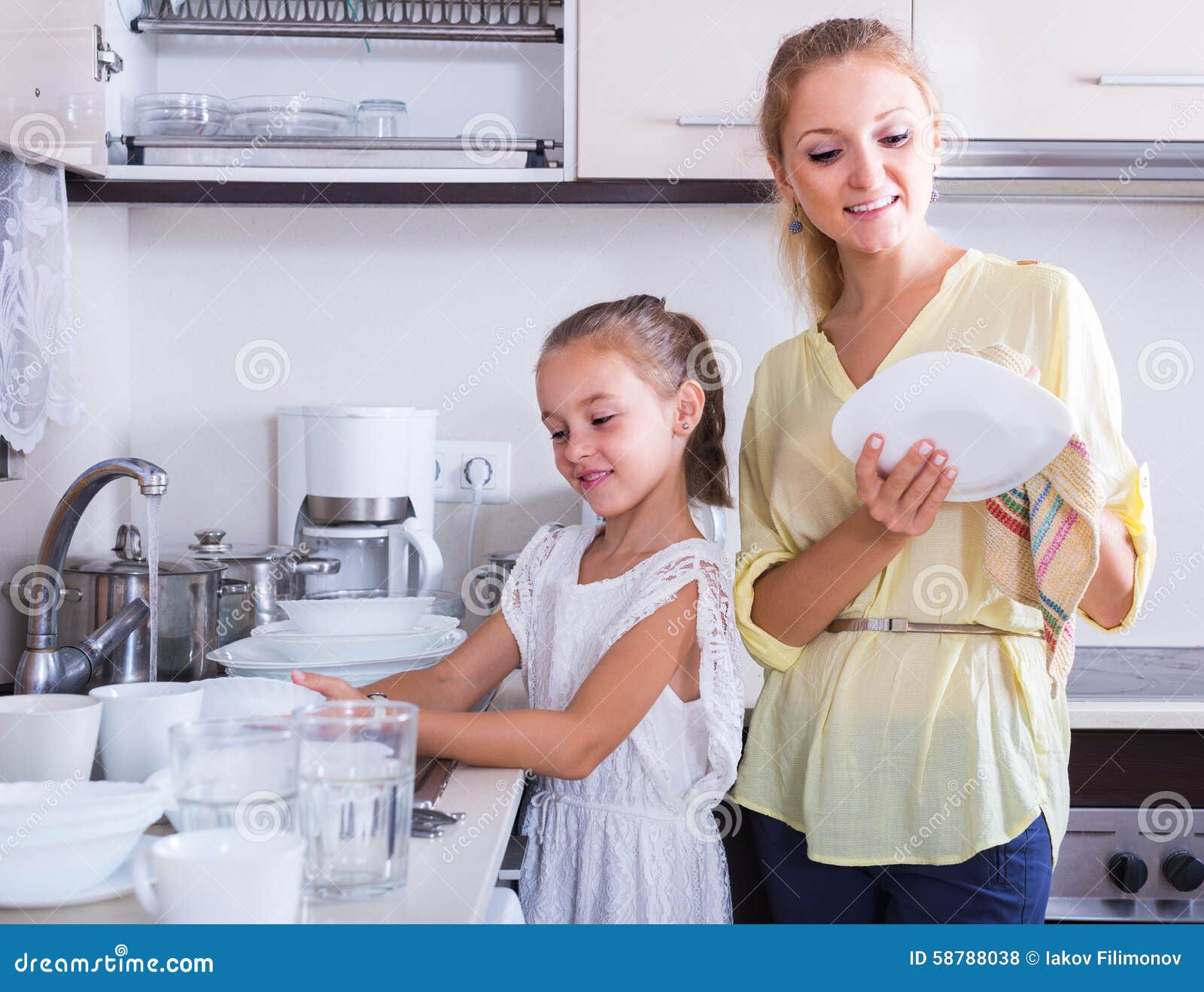 Girls Doing and Wiping Dishes in Kitchen Stock Photo - Image of kitchen ...