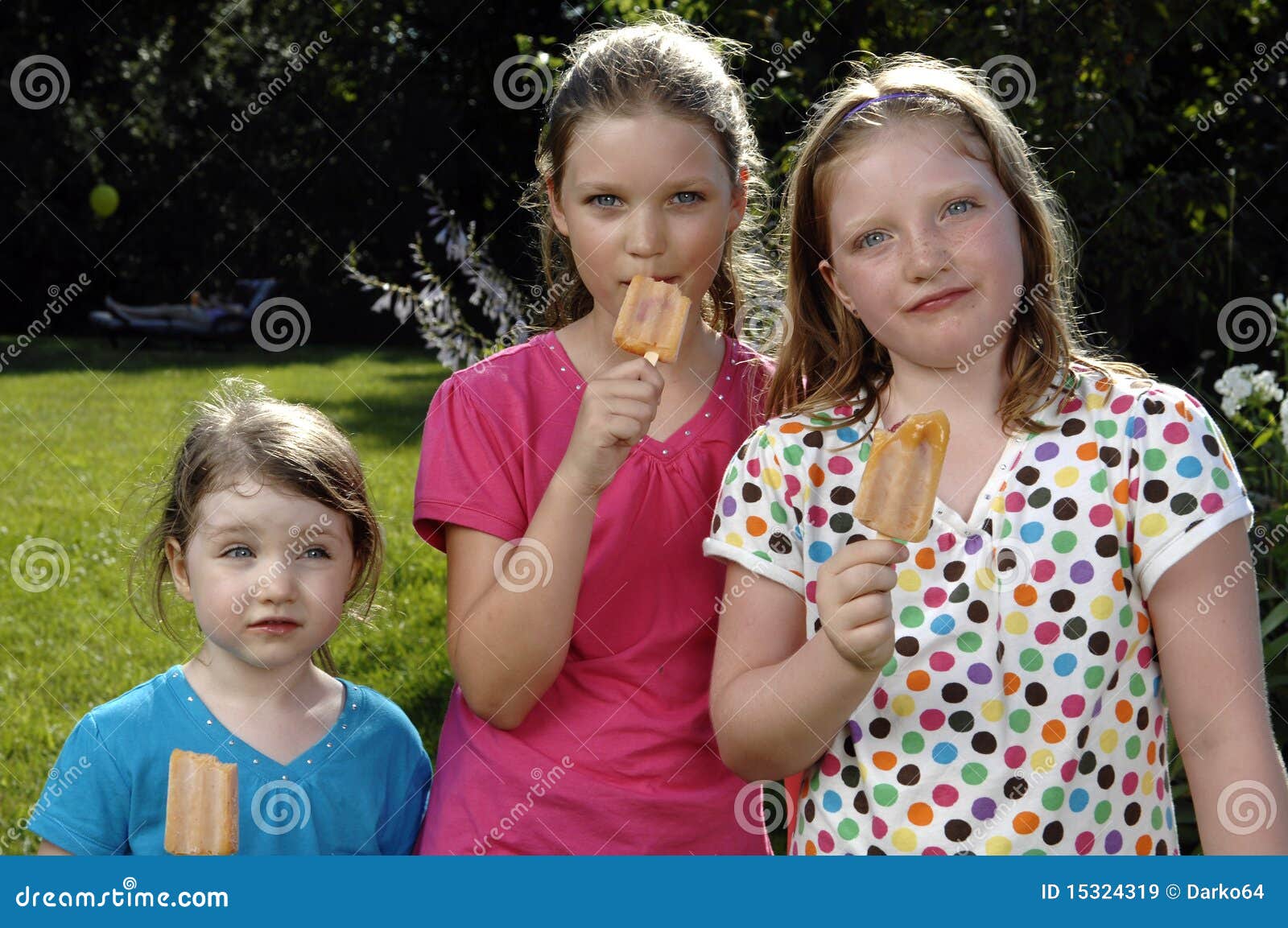 Girls eat popsicle stock image. Image of active, enjoyment - 15324319