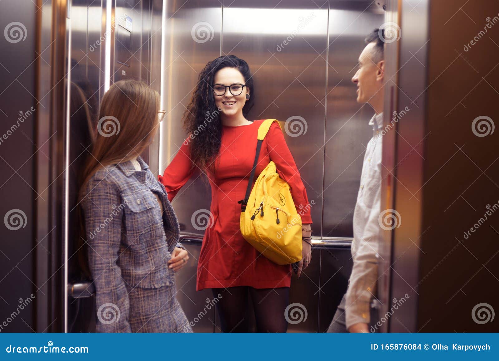 The Girls and the Guy Ride in the Elevator. Students in the Elevator Go ...