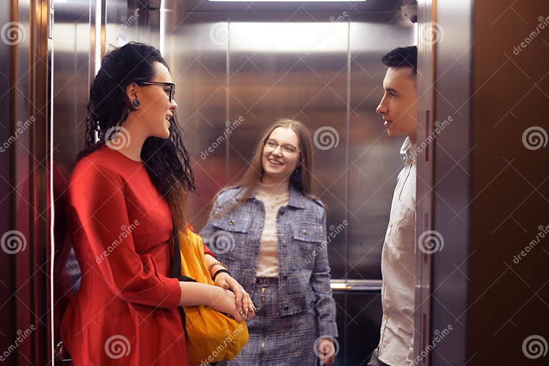 The Girls and the Guy Ride in the Elevator. Students in the Elevator Go ...
