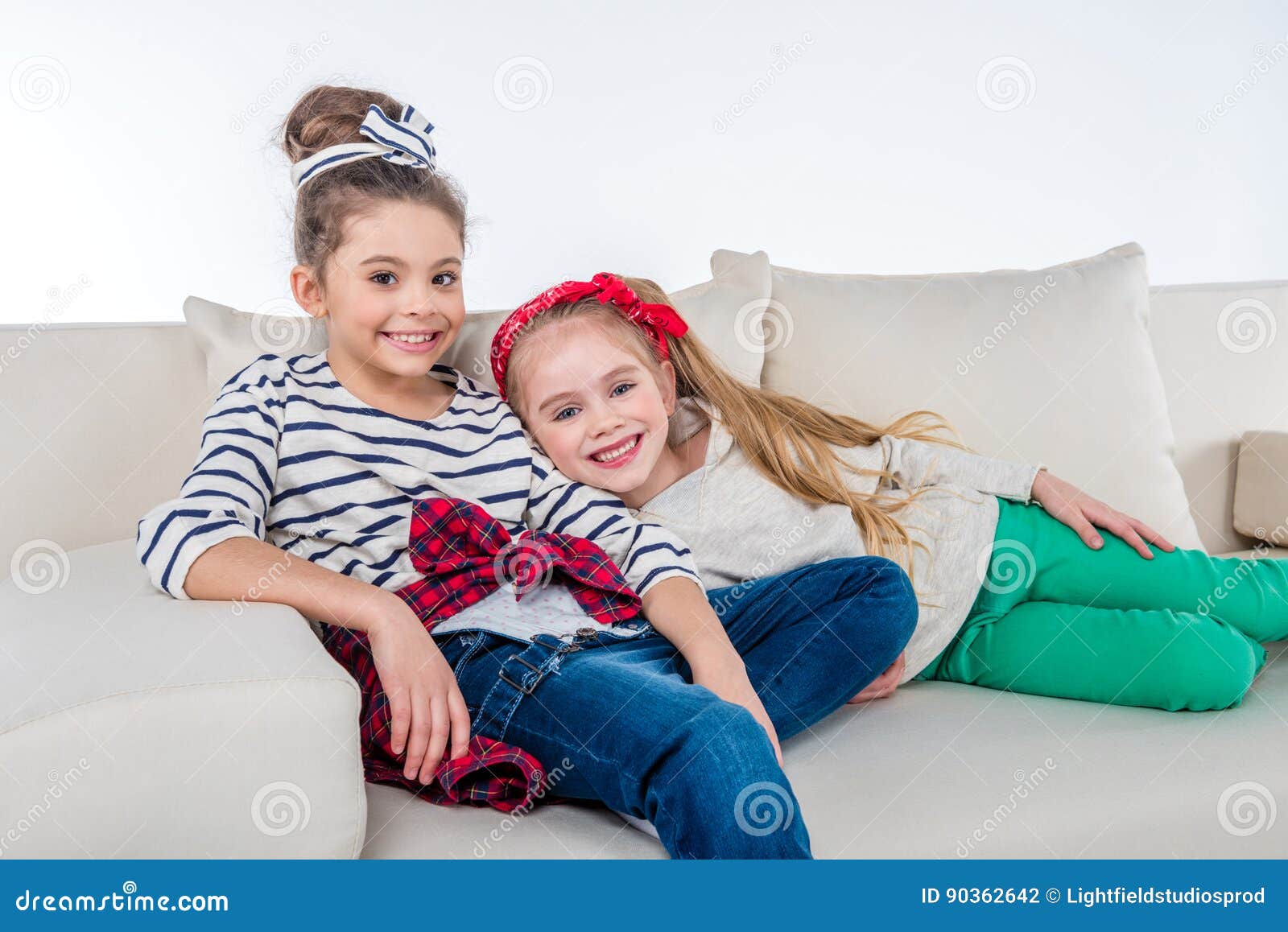 Girls having rest on sofa stock photo. Image of schoolgirls - 90362642