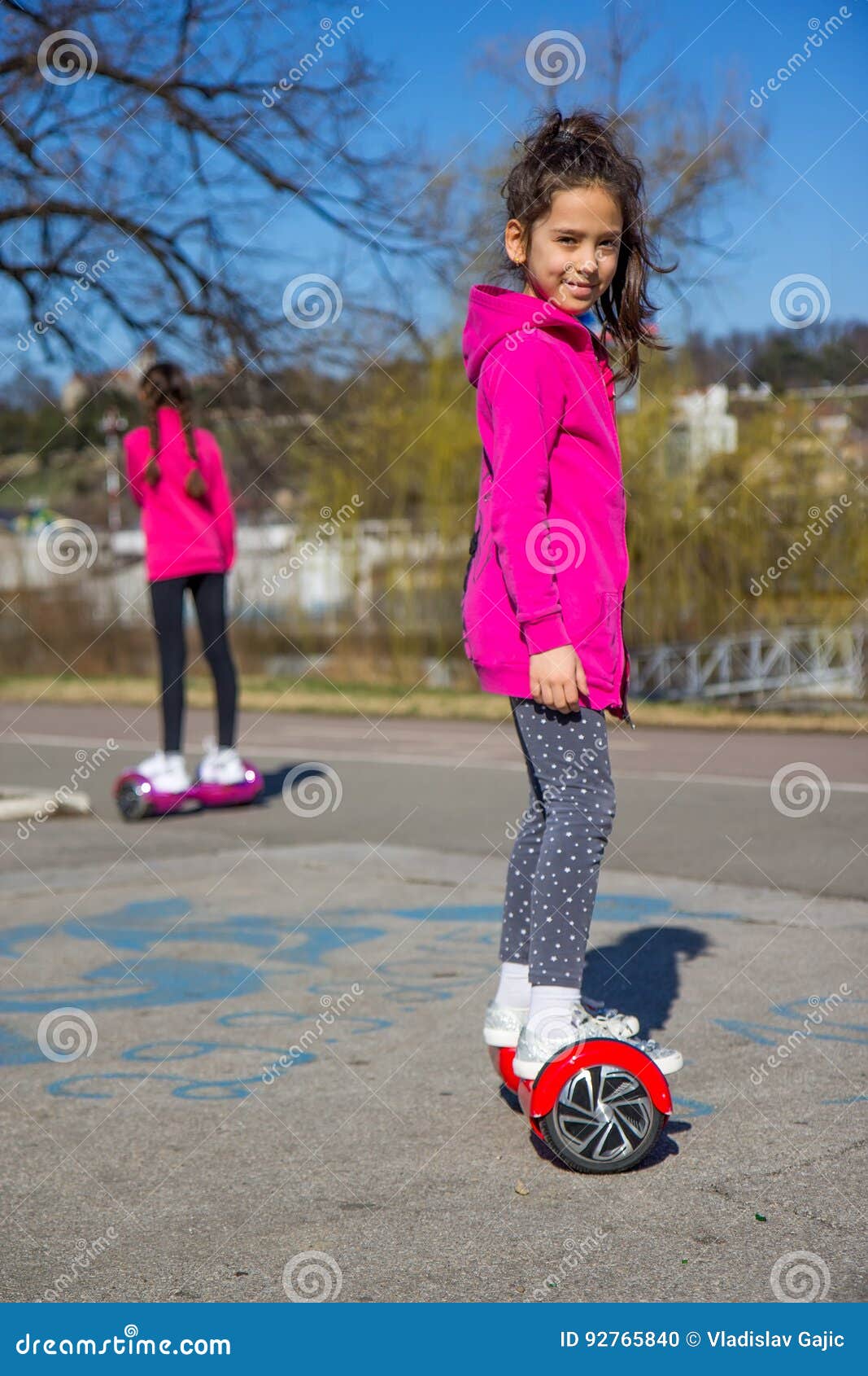 Girls on the hoverboard stock photo. Image of hoverboard - 92765840