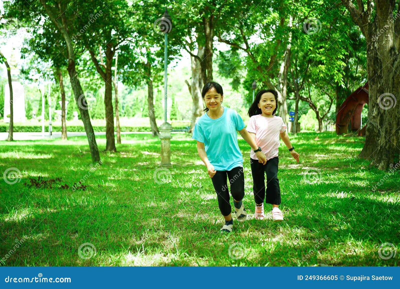 2 Girls Jogging in the Park Smiling. Stock Image - Image of caucasian ...