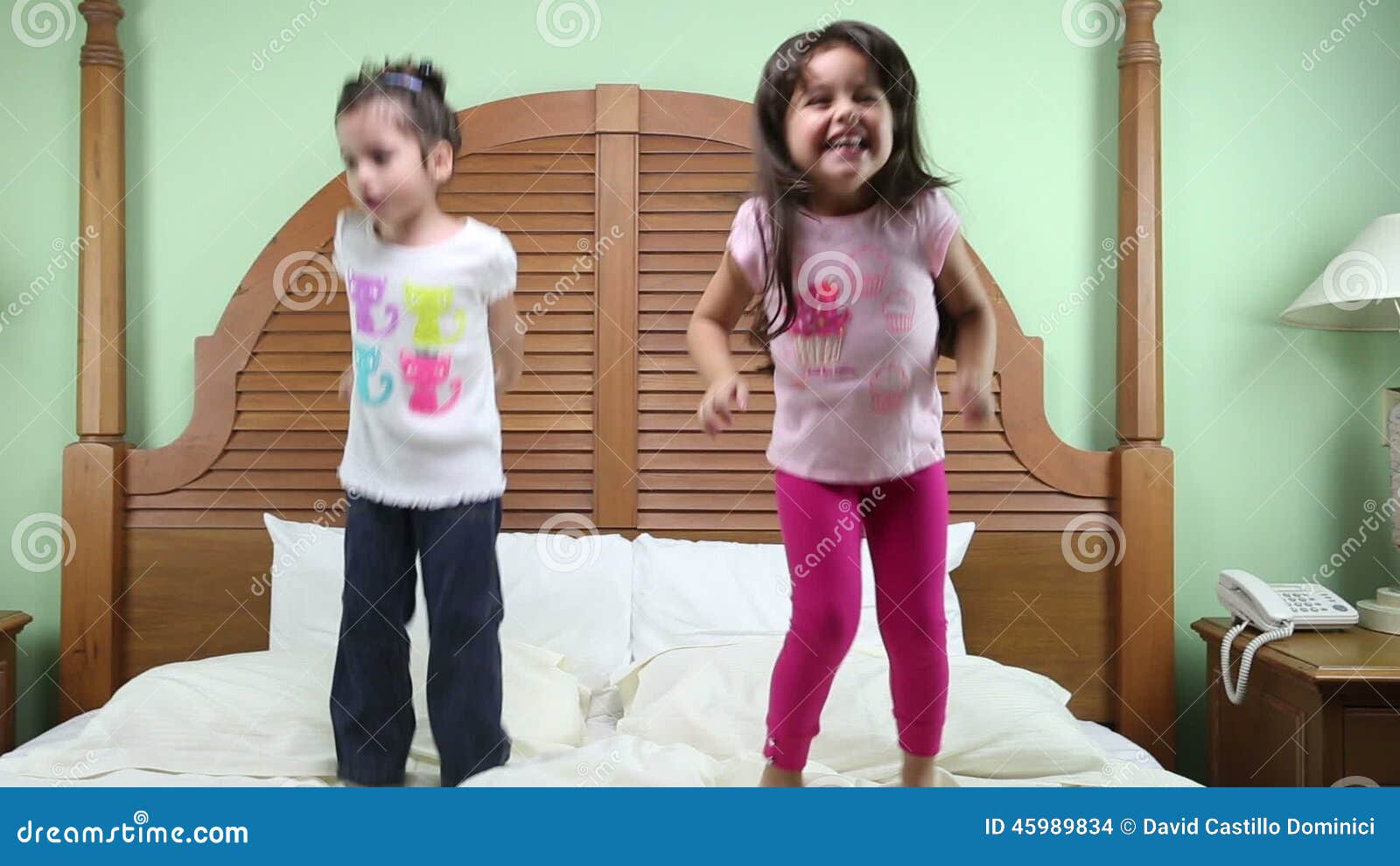 Girls jumping in the bed stock footage. Video of girls - 45989834