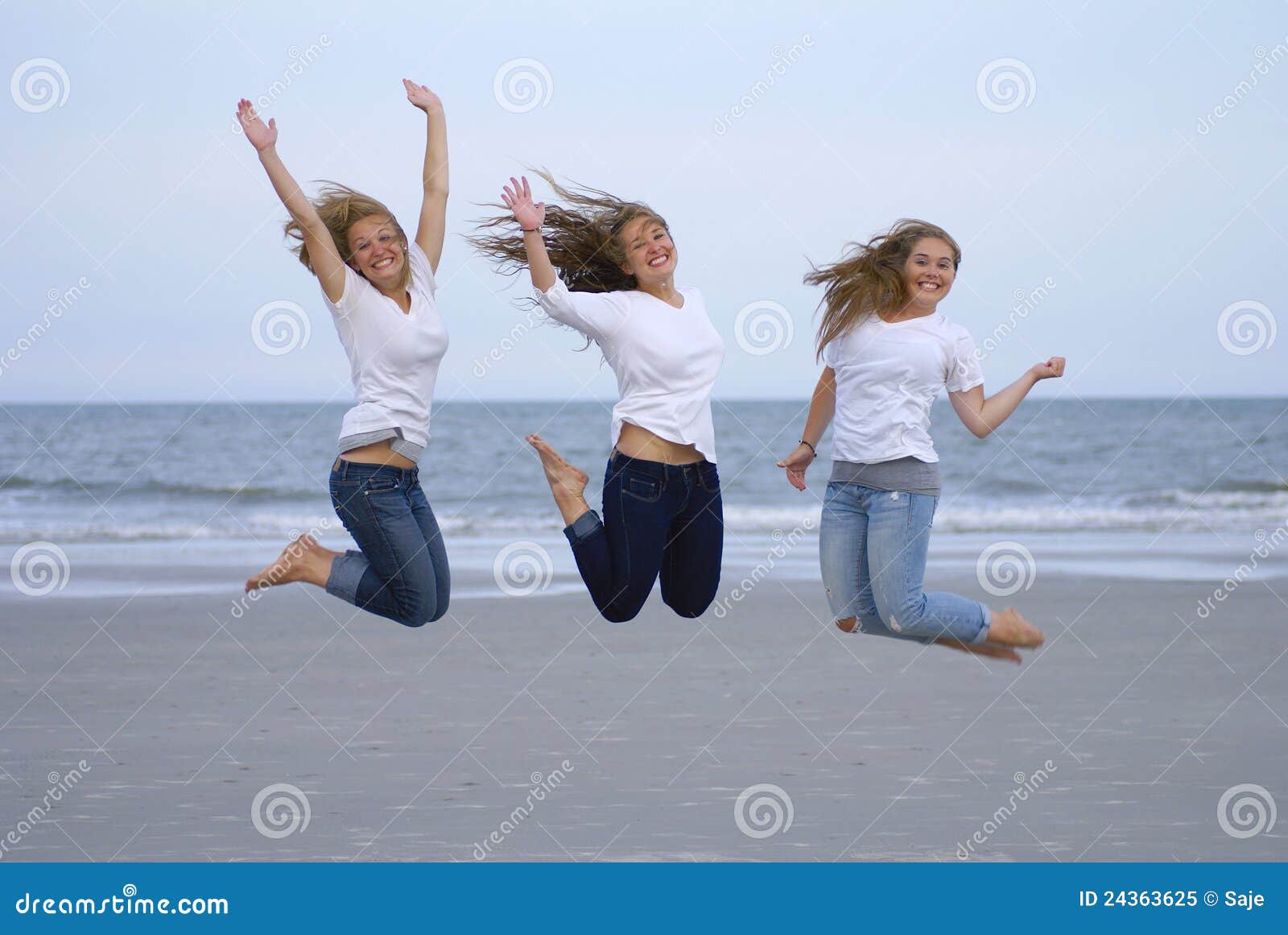 Girls Jumping for Joy on Beach Stock Image - Image of beach, blue: 24363625