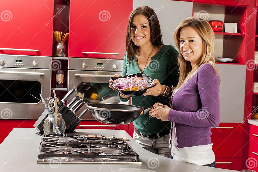 Girls in the kitchen stock image. Image of friendship - 27712949