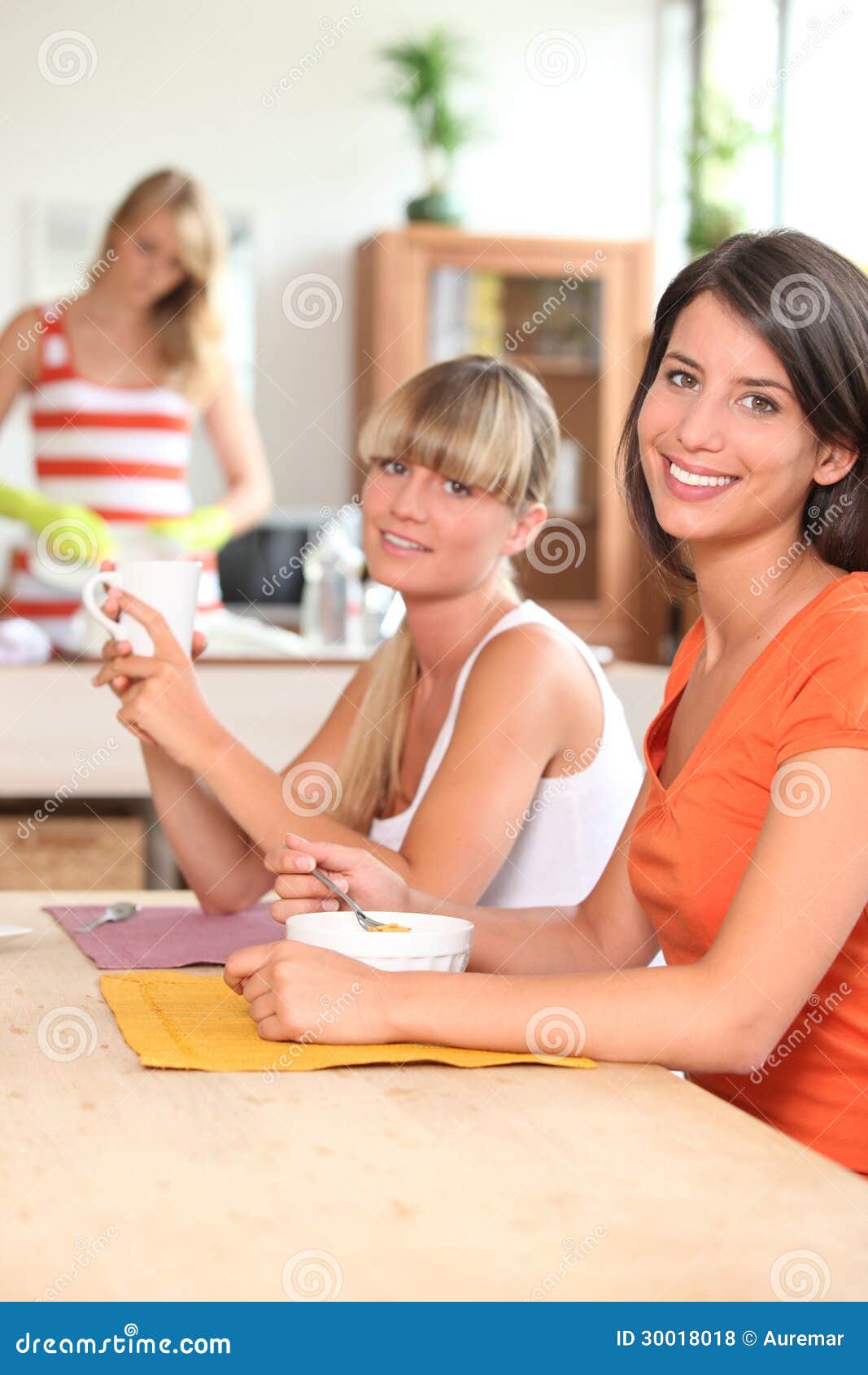 Girls eating breakfast stock photo. Image of habit, crockery - 30018018