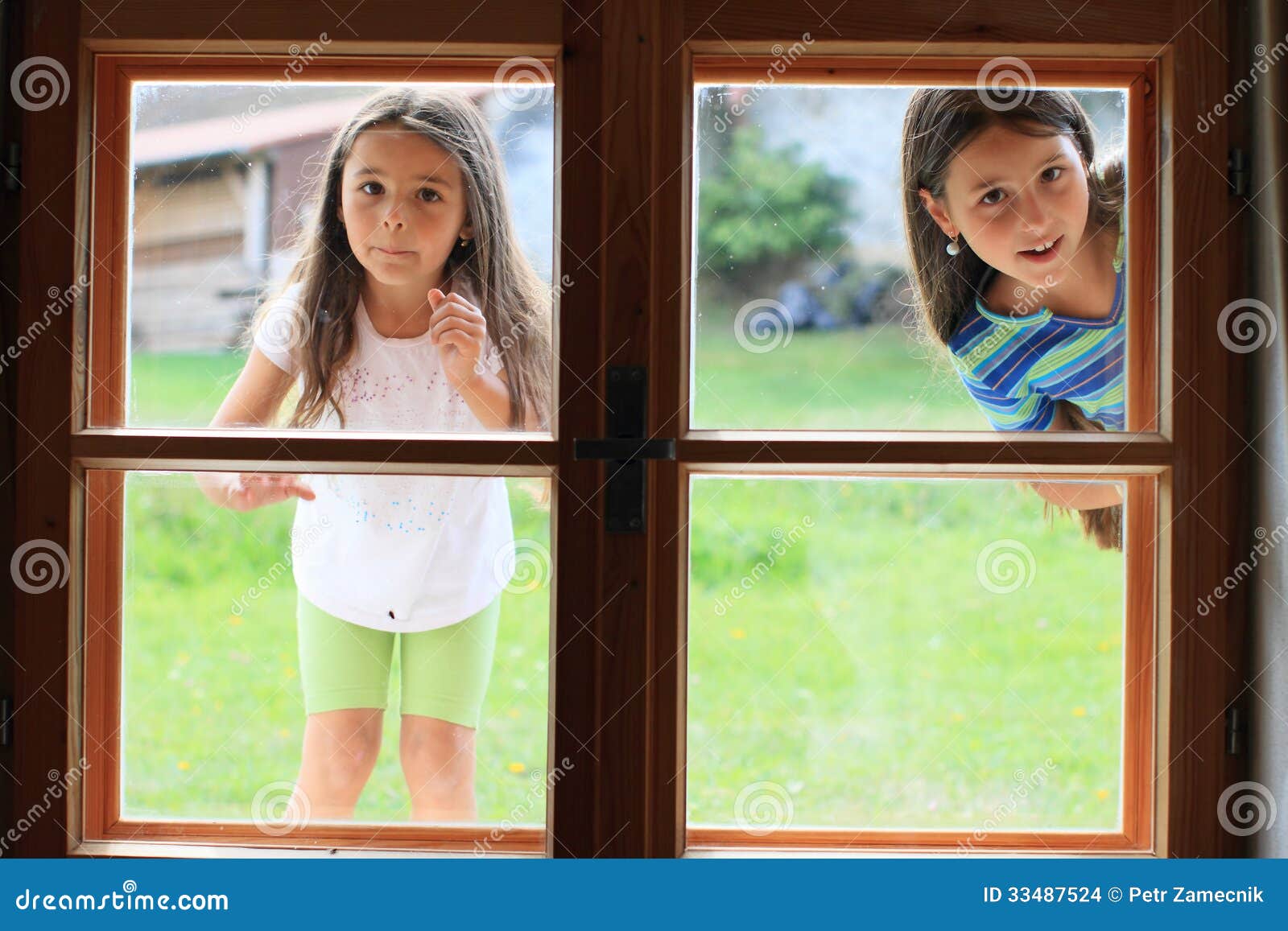 Girls looking into window stock photo. Image of wooden - 33487524