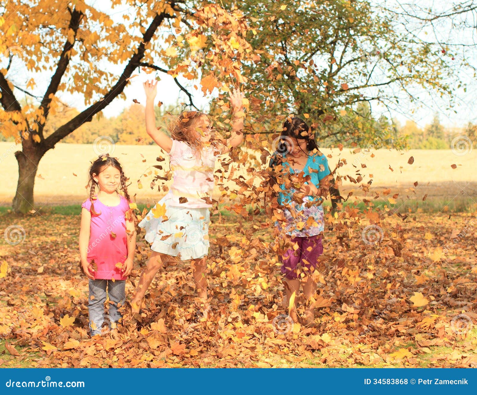 Girls Playing Barefoot with Fallen Leaves Stock Photo - Image of bare ...