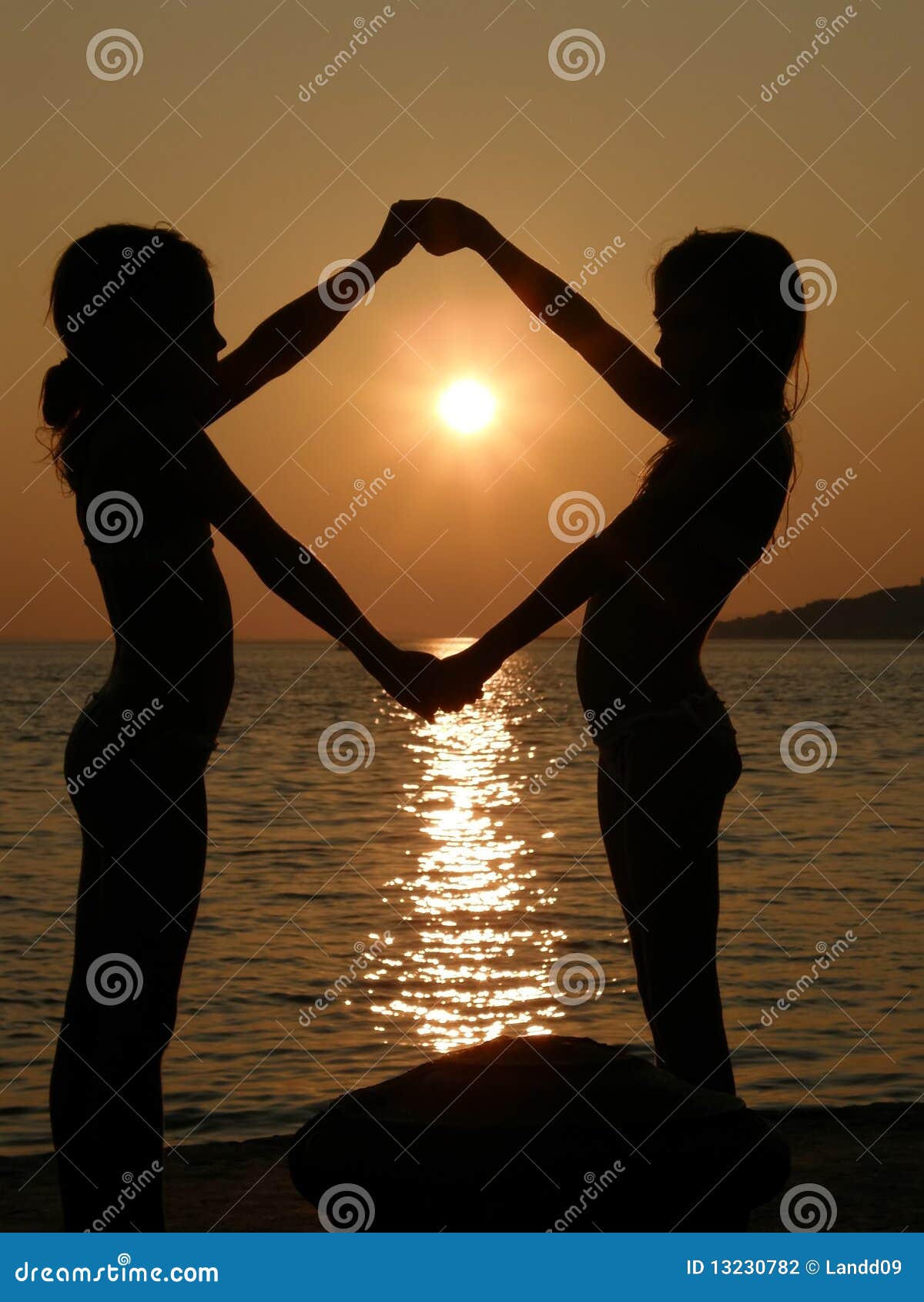 Girls playing in sunset stock photo. Image of beach, little - 13230782