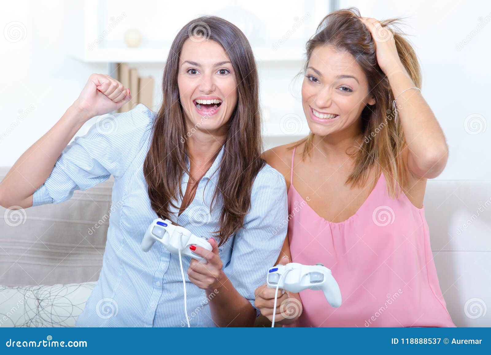 Girls playing video game stock image. Image of technology - 118888537