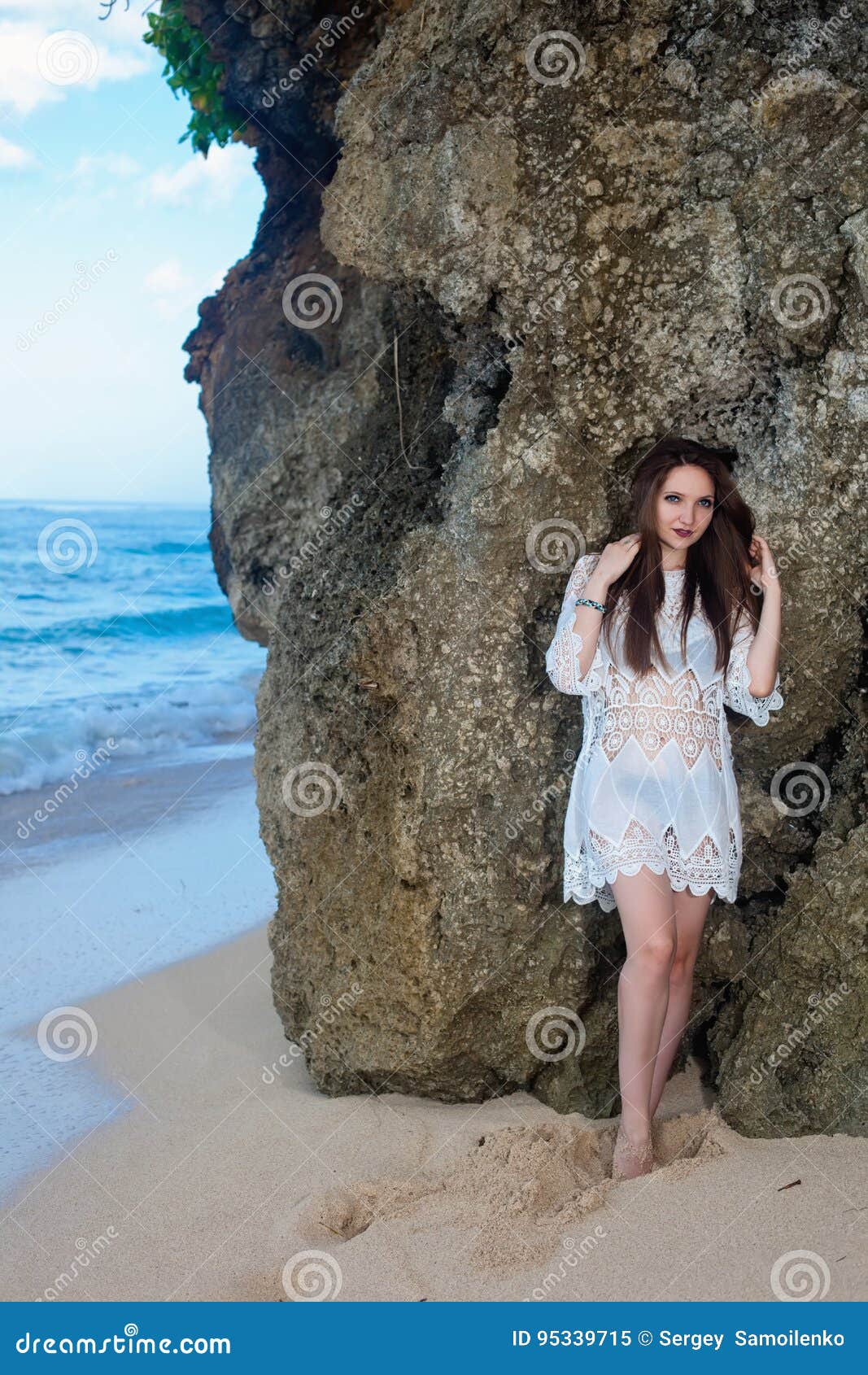 Girls Posing on the Beach in Front of the Rock. Stock Image - Image of ...