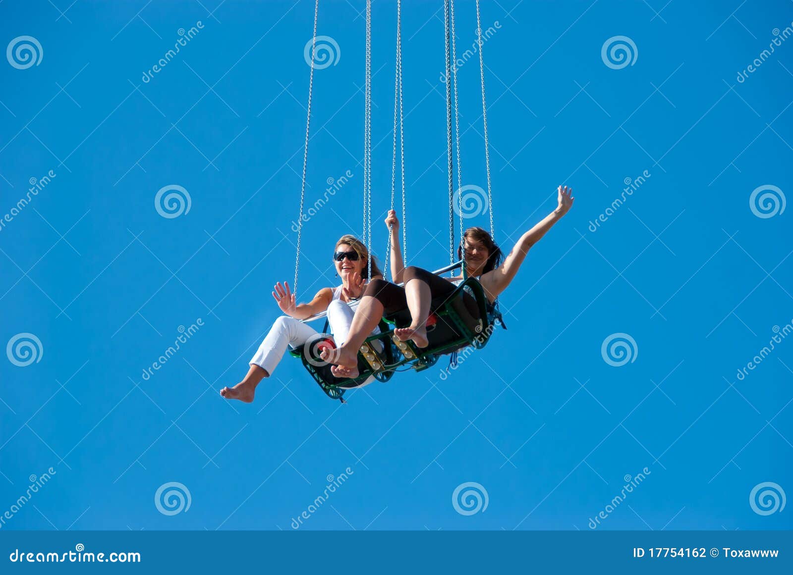 Girls Ride on the Chain Carousel Stock Photo - Image of laugh, playtime ...
