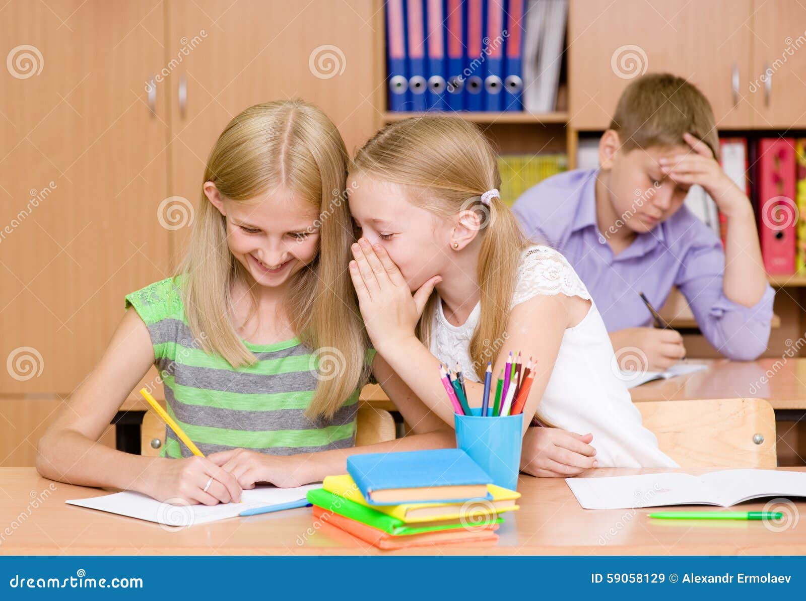 Girls Sharing Secrets in Classroom Stock Image - Image of elementary ...